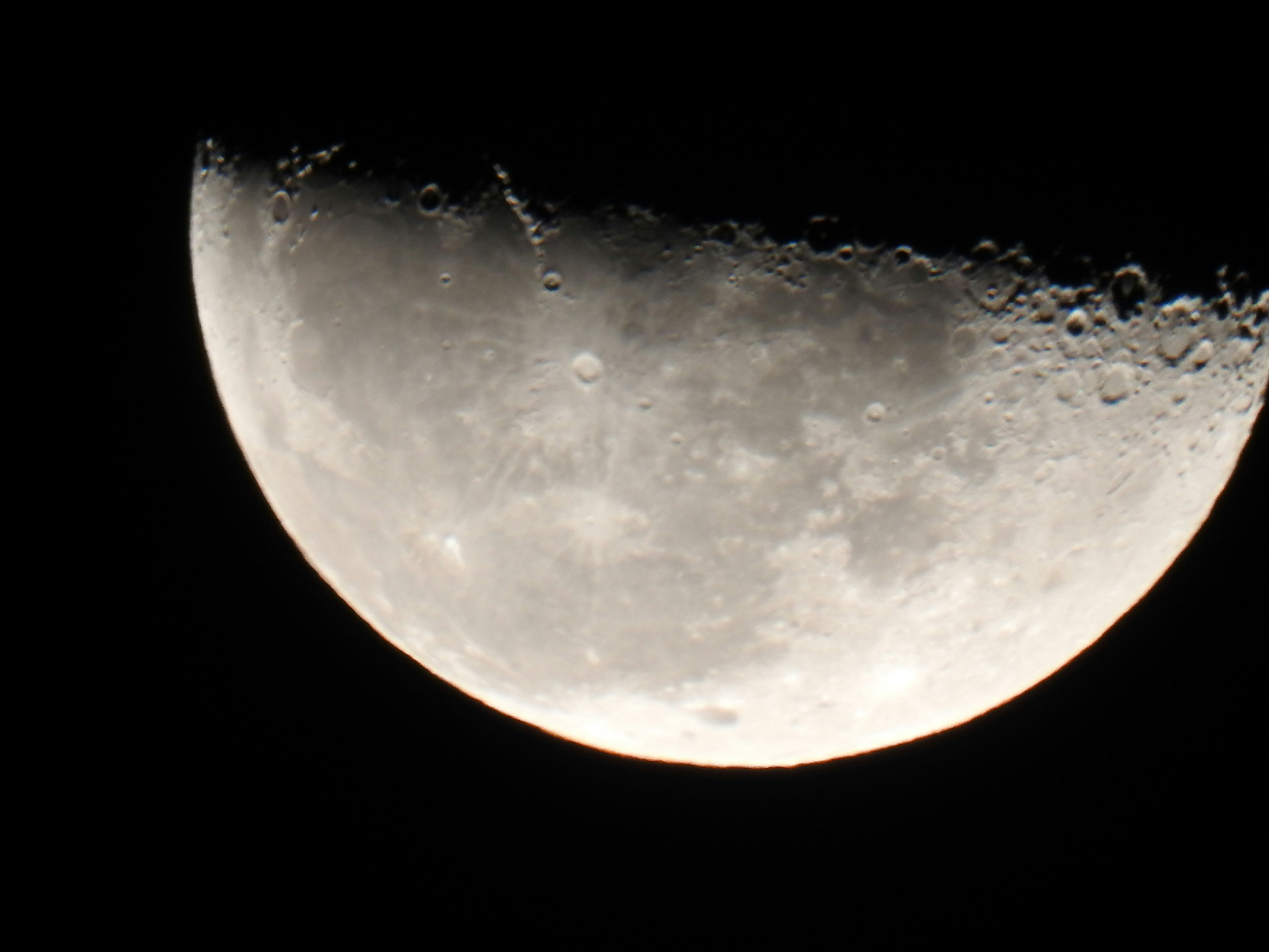 Moonlit Helmet: A Thin Crescent in Sharp Focus