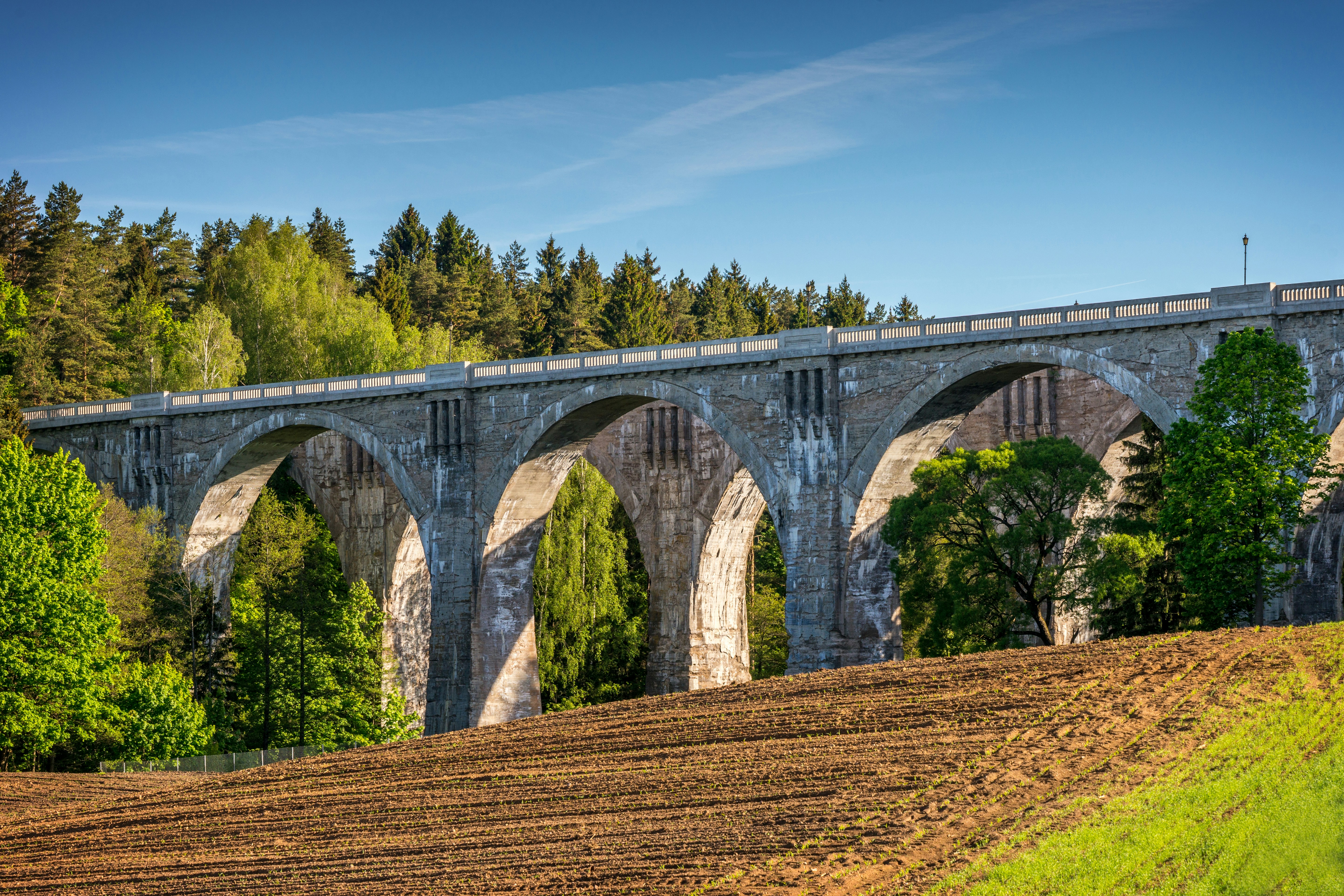 Stone arches across the sunlit countryside