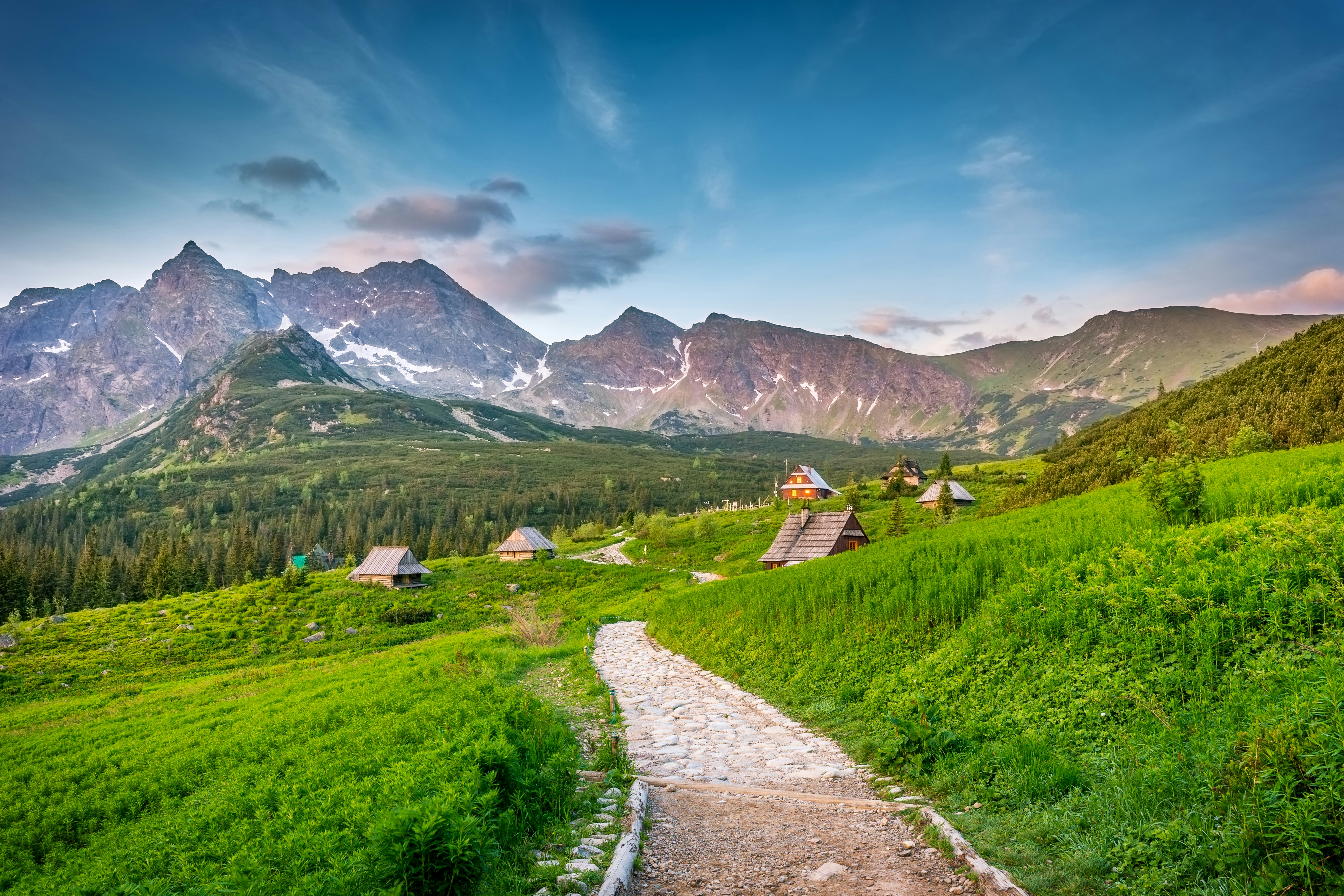 Ridgepath to the Alpine Village beneath snow-dusted Peaks