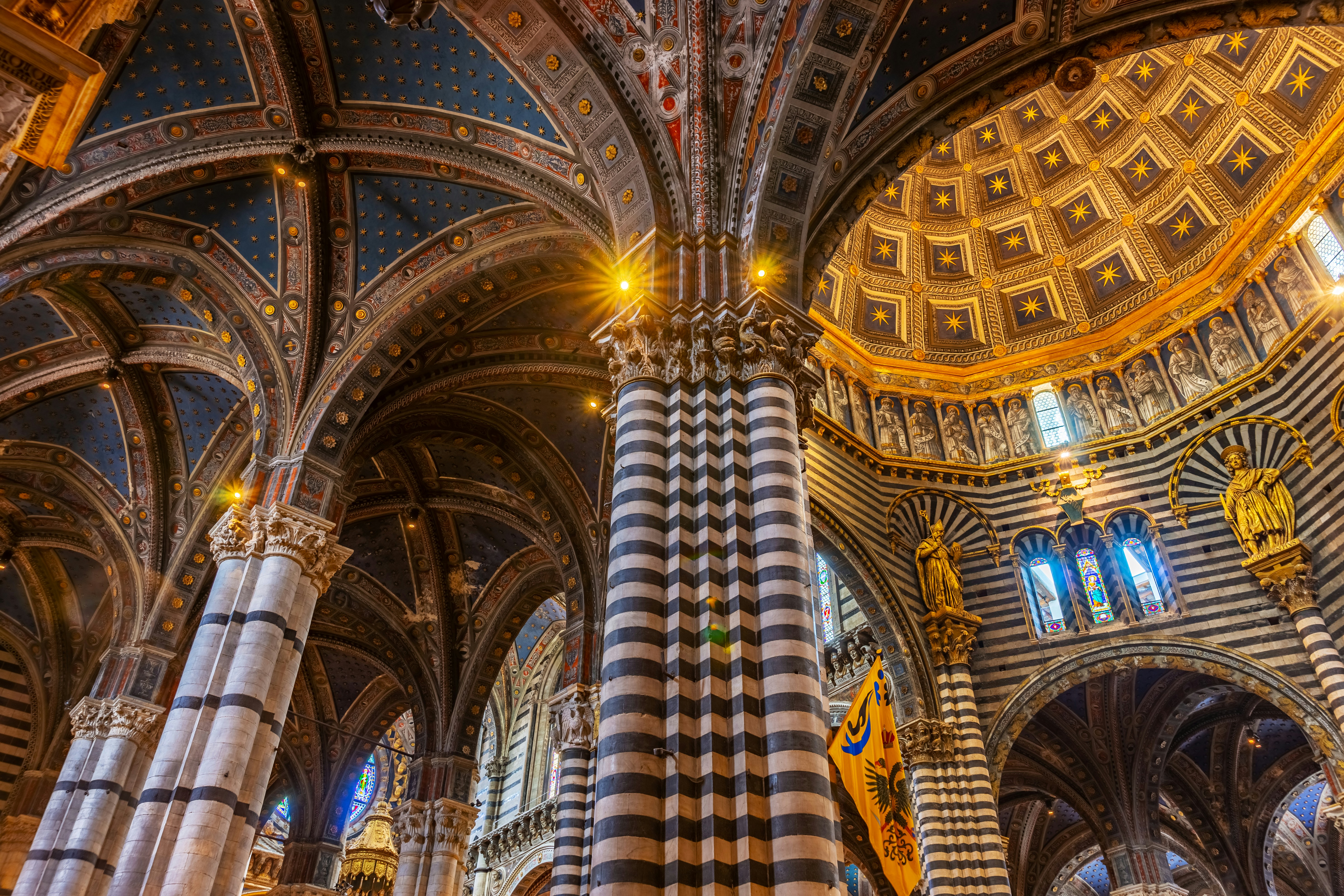 Striped Columns Rise in a Cathedral of Gold and Stone