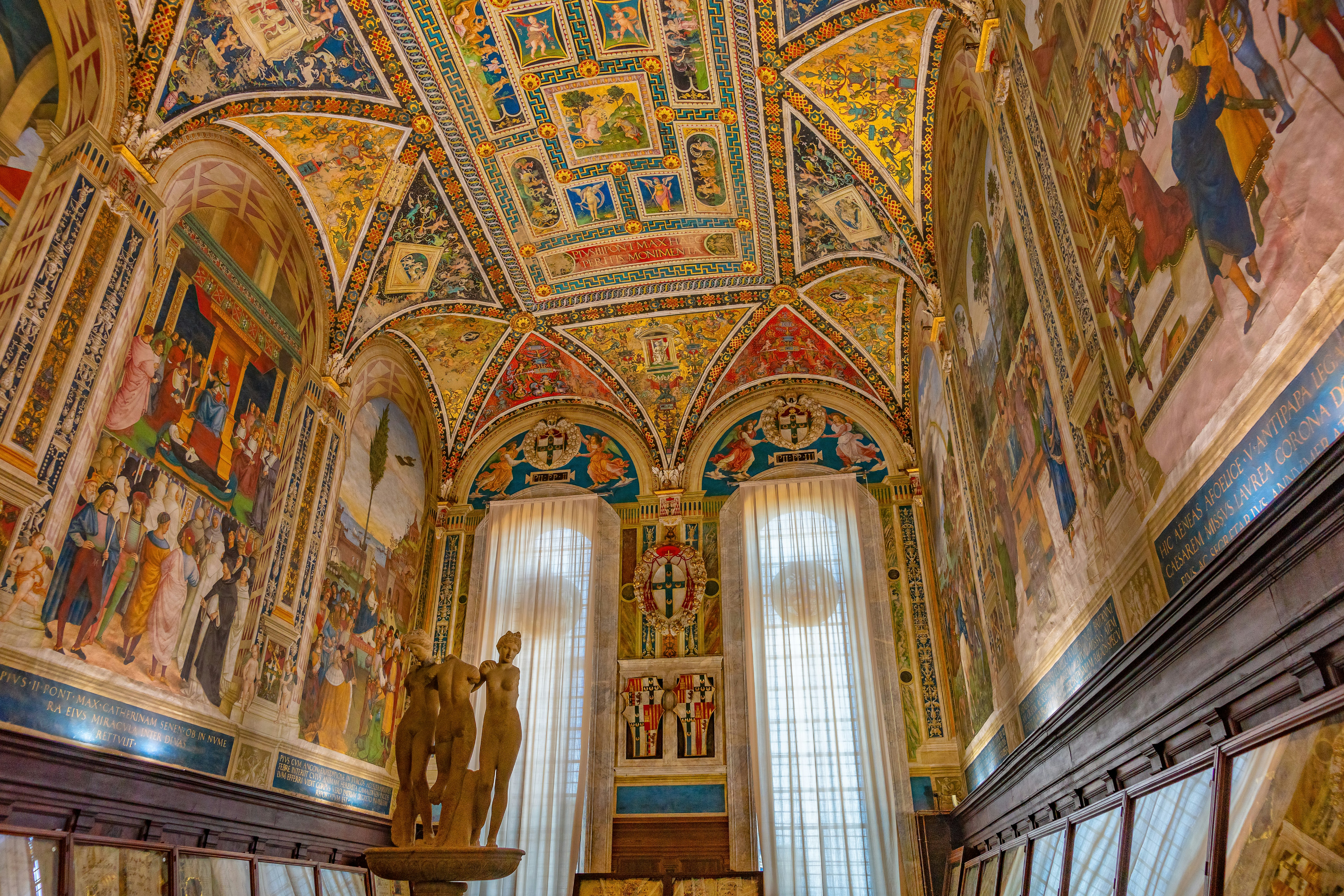 Golden Veins of a Cathedral Gallery: A Sculpted Moment under Painted Arches