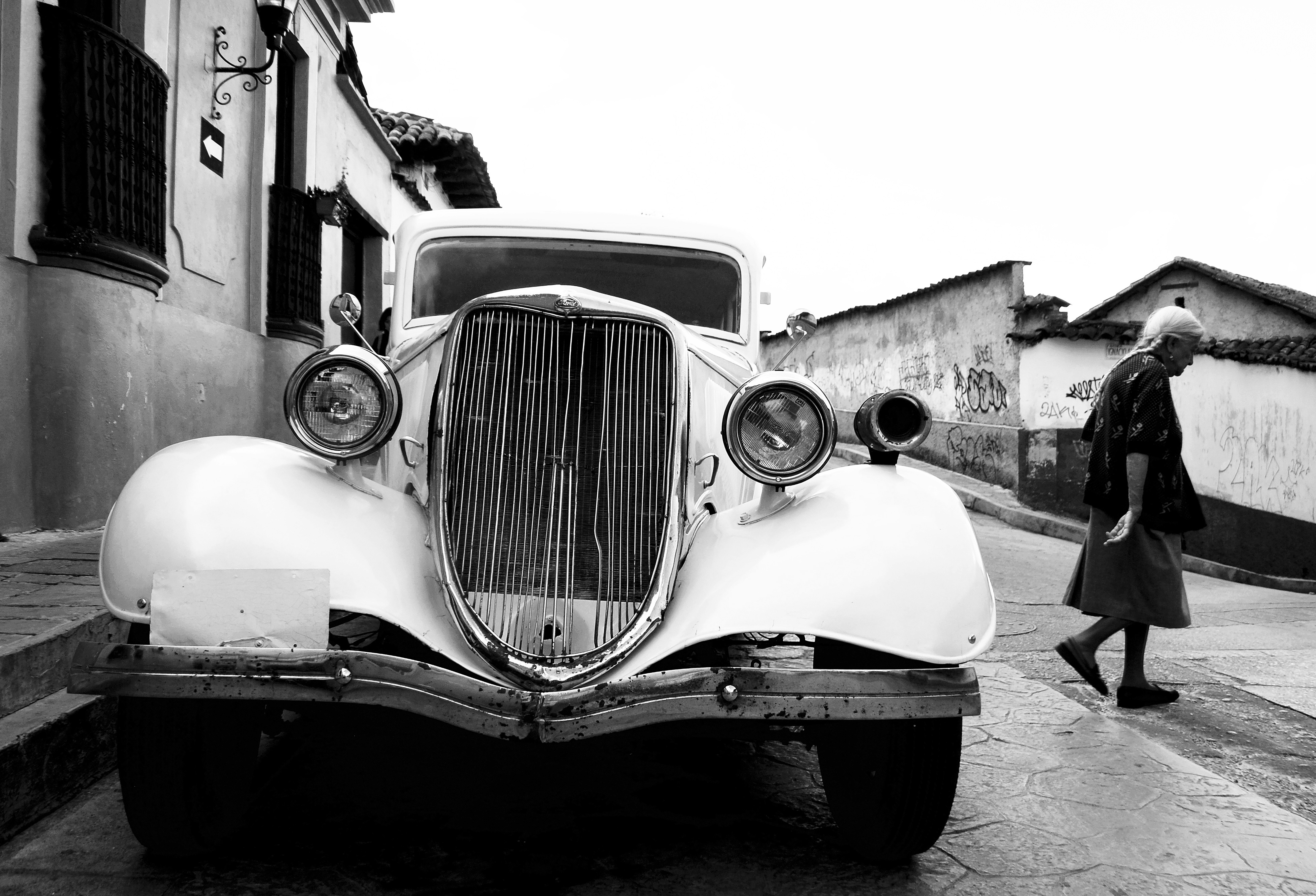 Front View of a Vintage Grille: A Quiet Street Moment in Monochrome