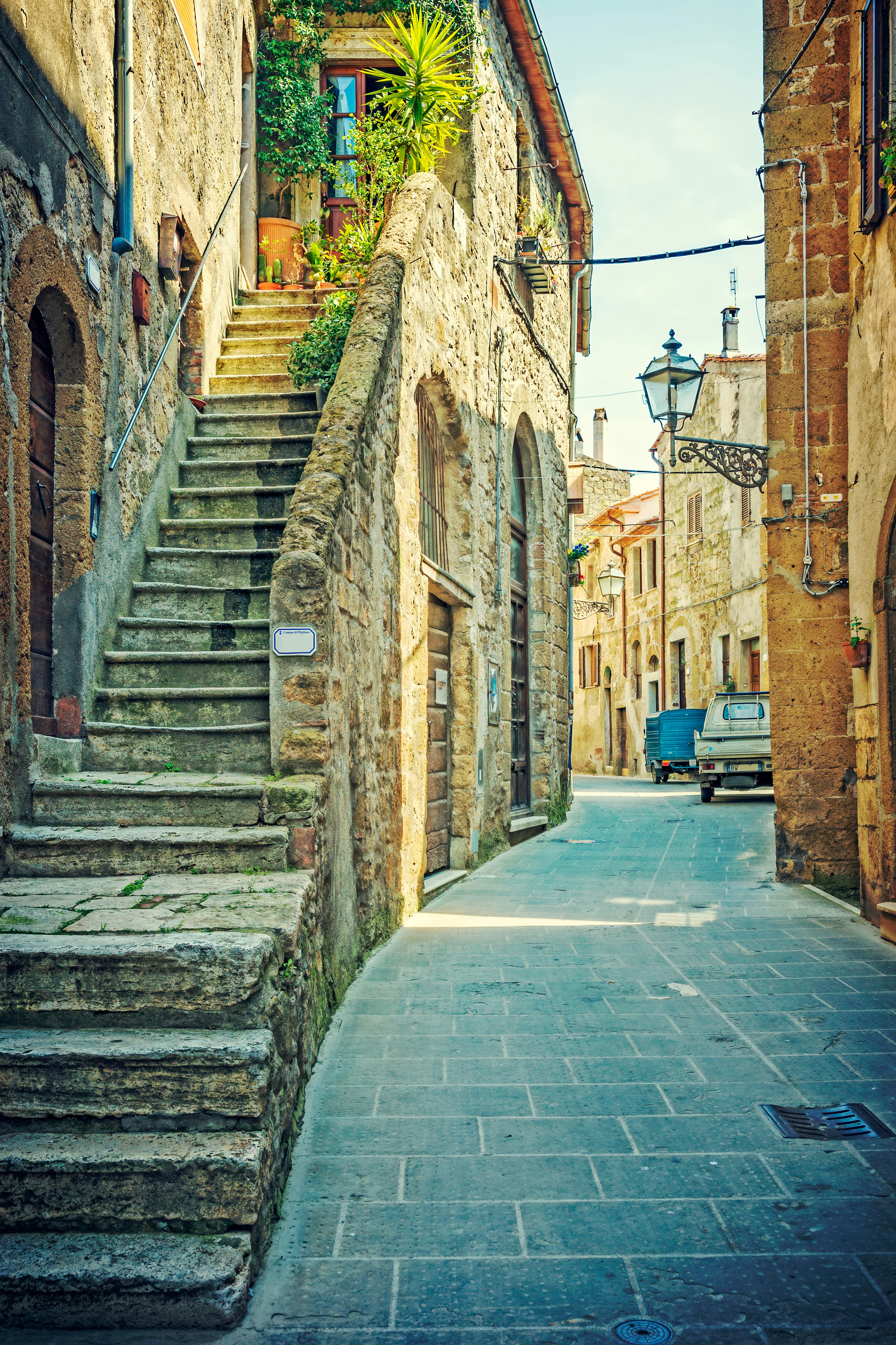 Renaissance Lane: Sunlit Alley Between Stony Walls