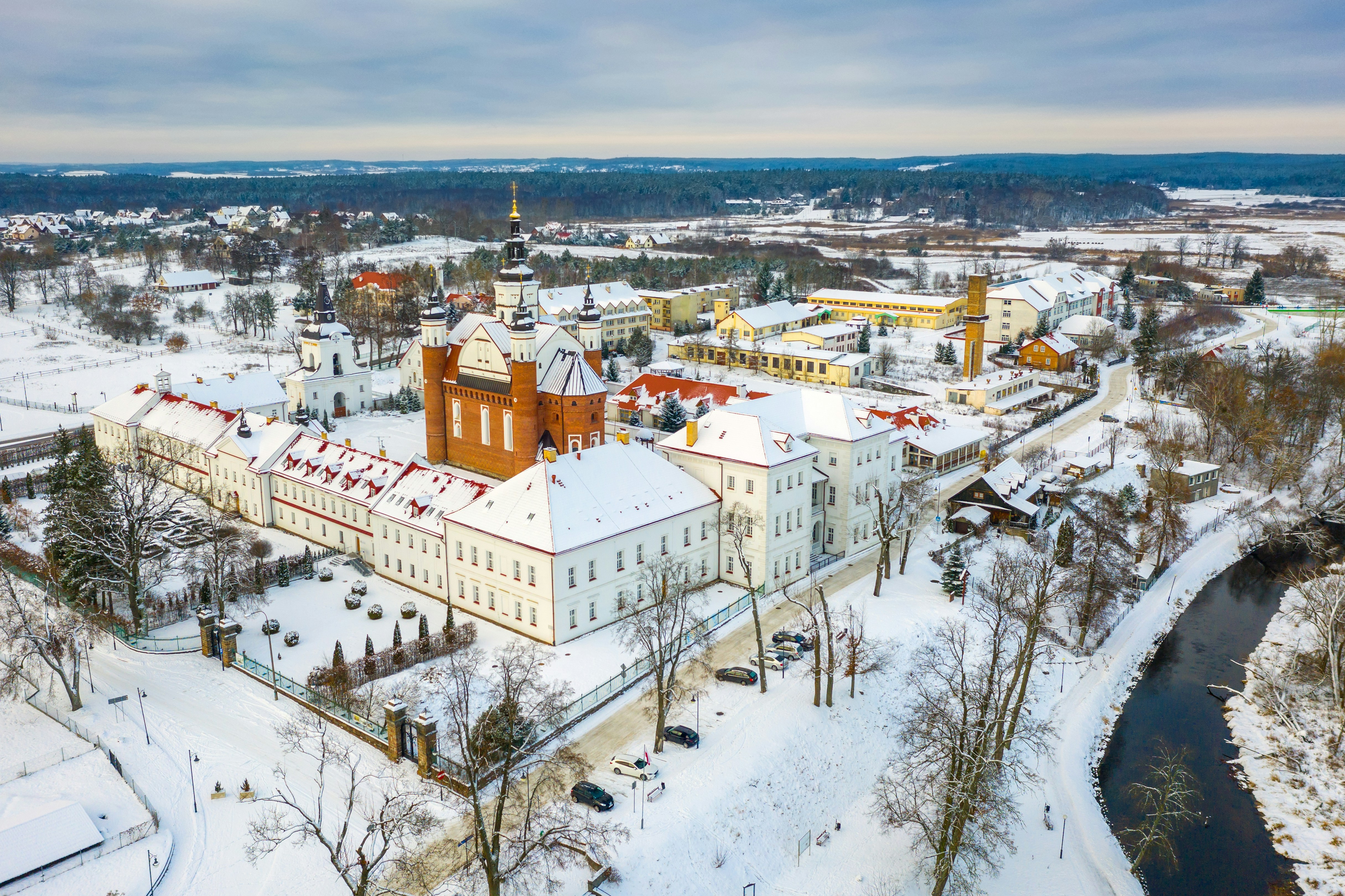 Snowbound Citadel: Aerial Chorus Over a Frosted Monastery Quarter