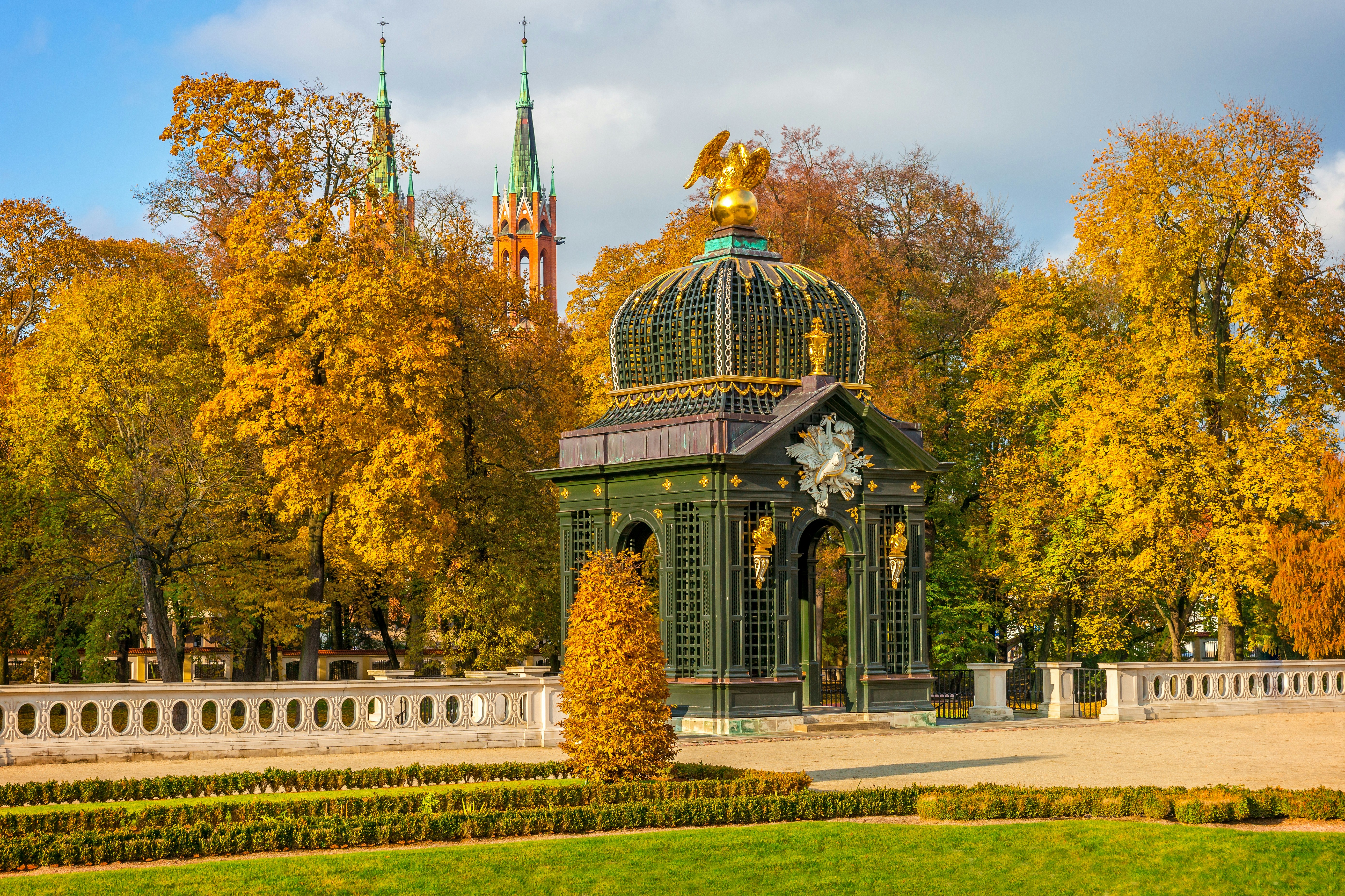Autumn Pavilion: Golden Foliage Framing a Baroque Garden Structure