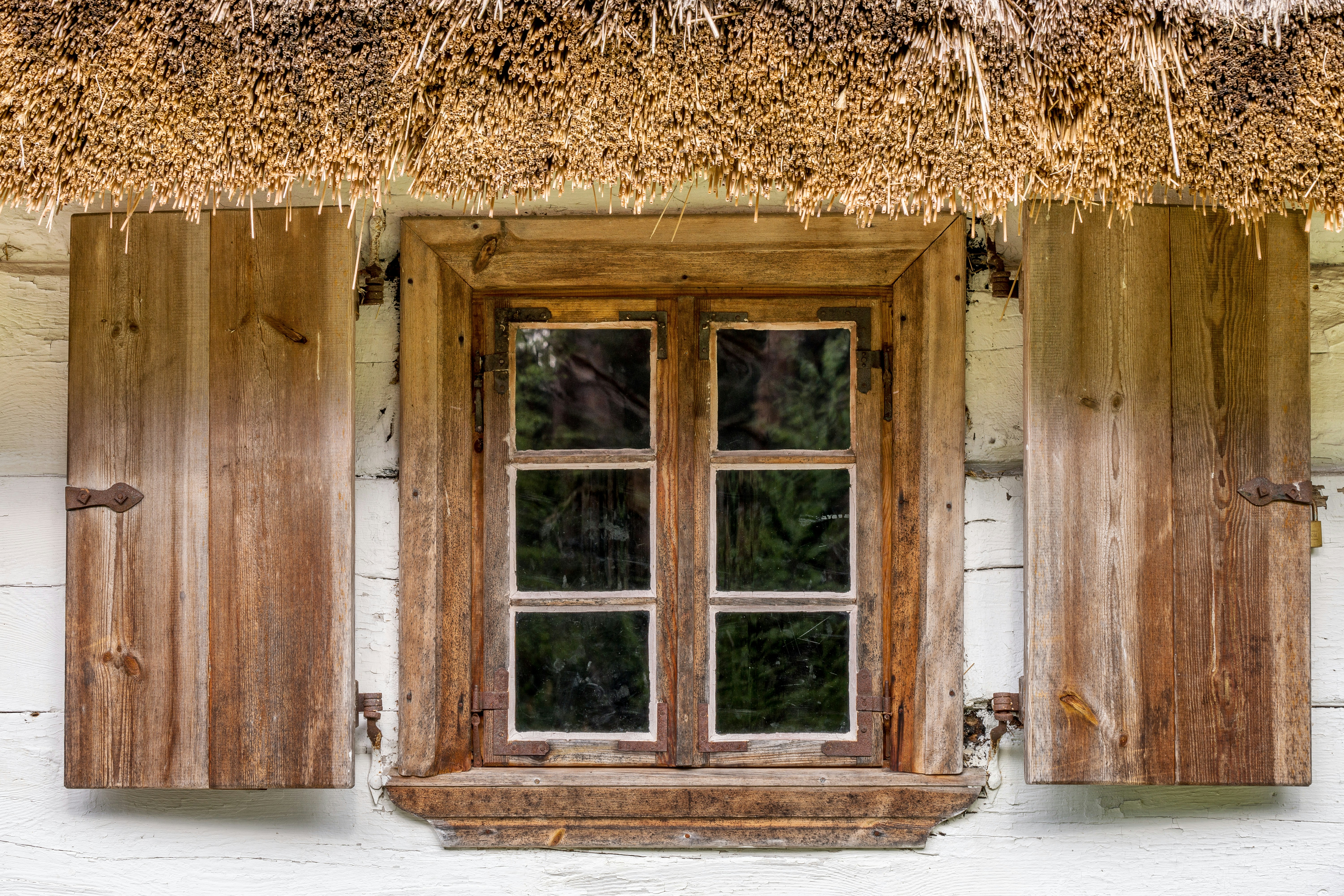 Weathered Window with Shuttered Charms