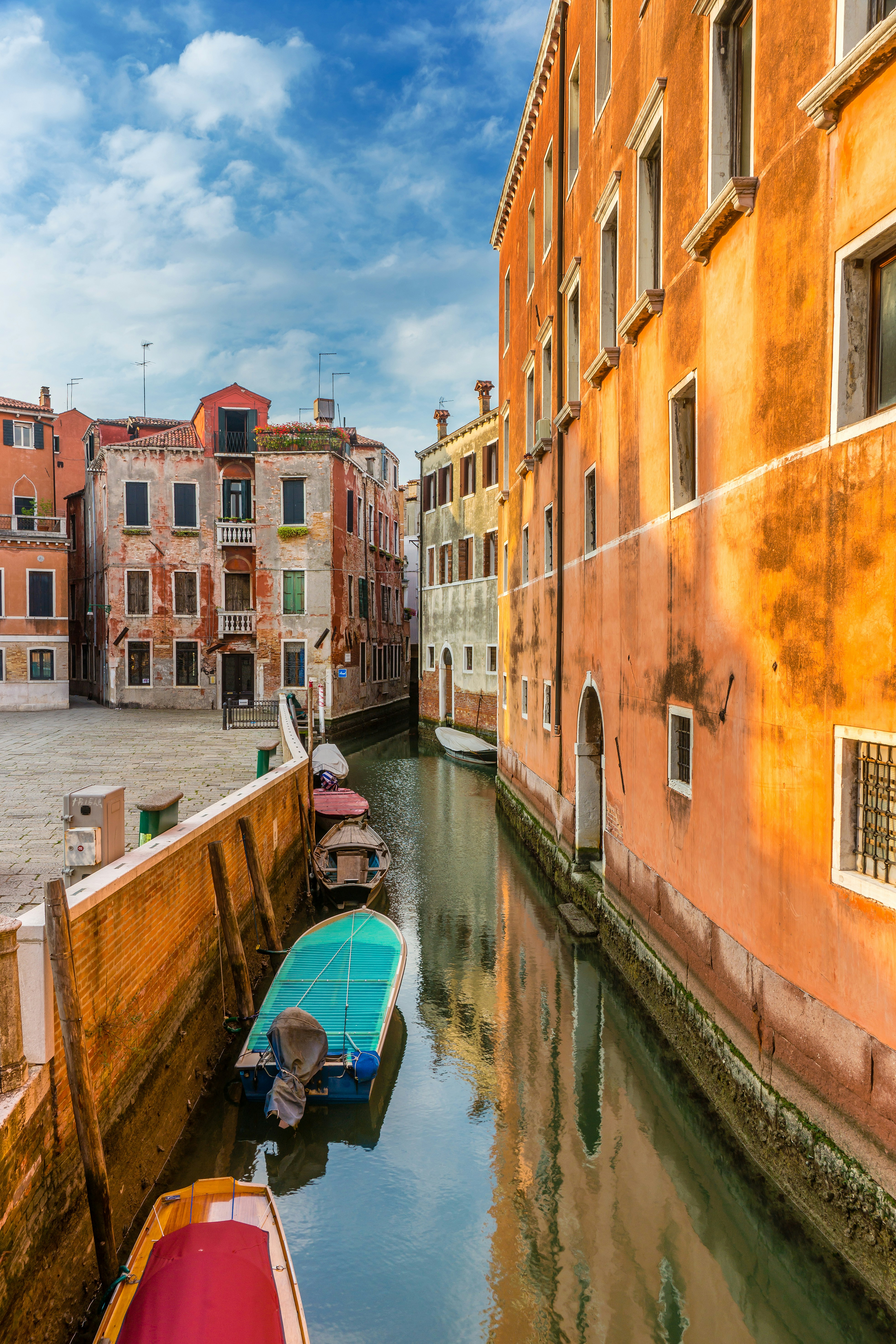 Canalway Facades in Sunlit Verona-like Alleys