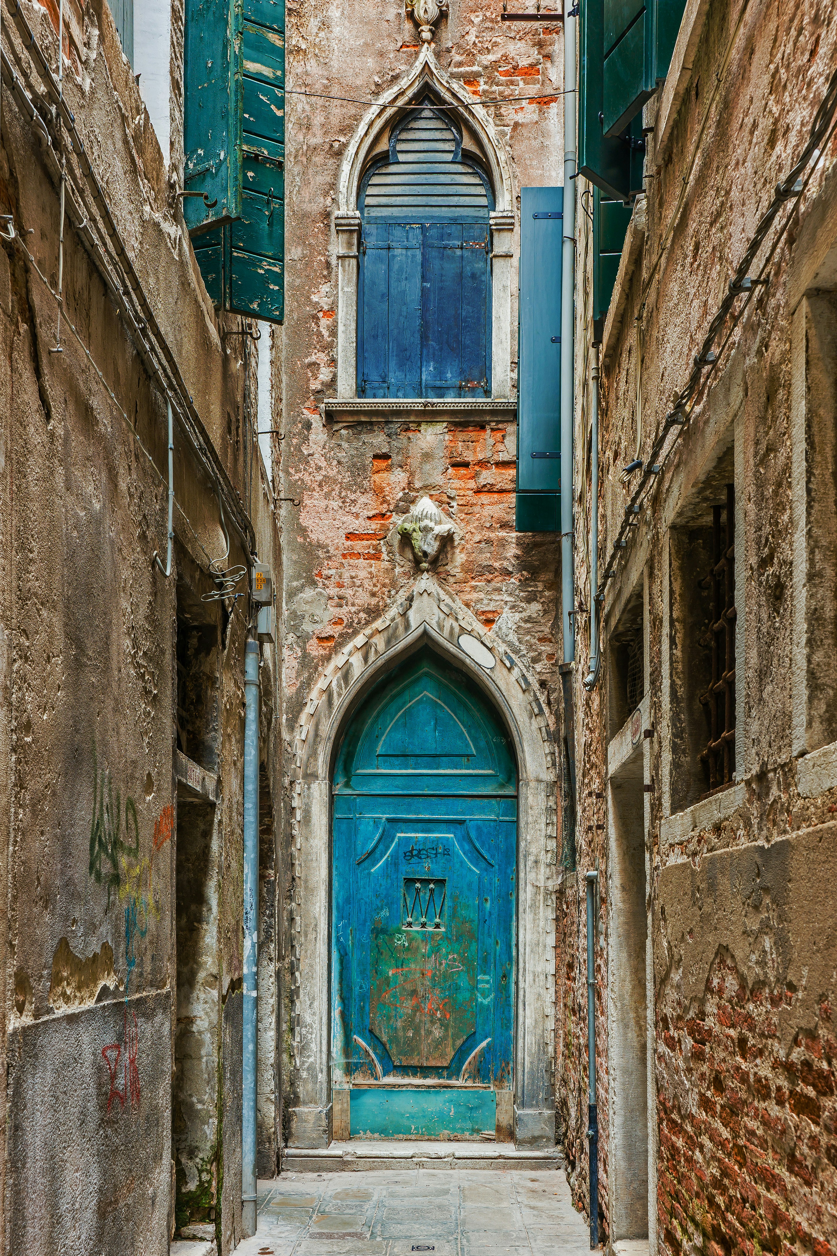 Blue Doorway in a Worn Venetian Alley