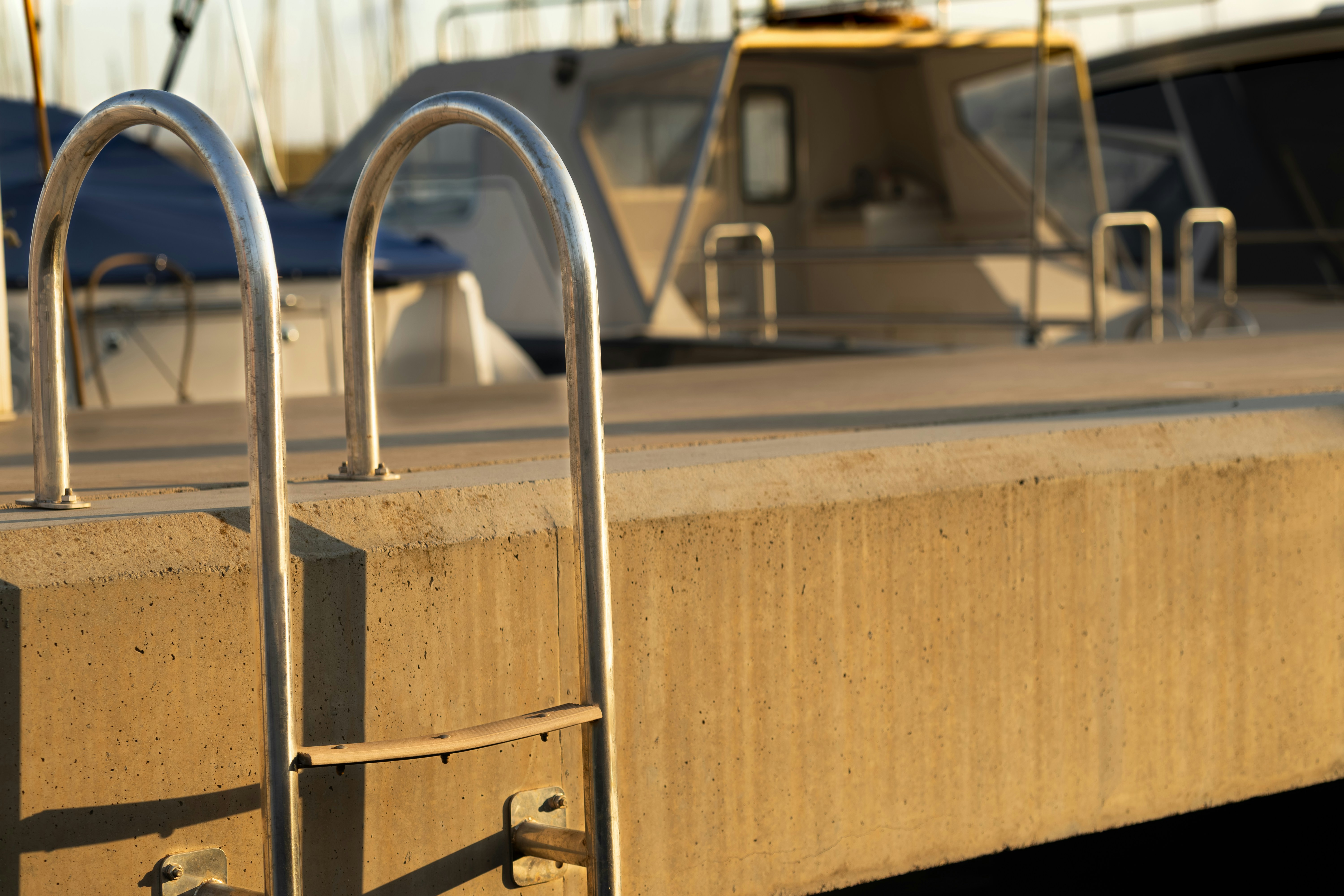 Marina Concrete Edge: A Quiet Dock with Metal Railing