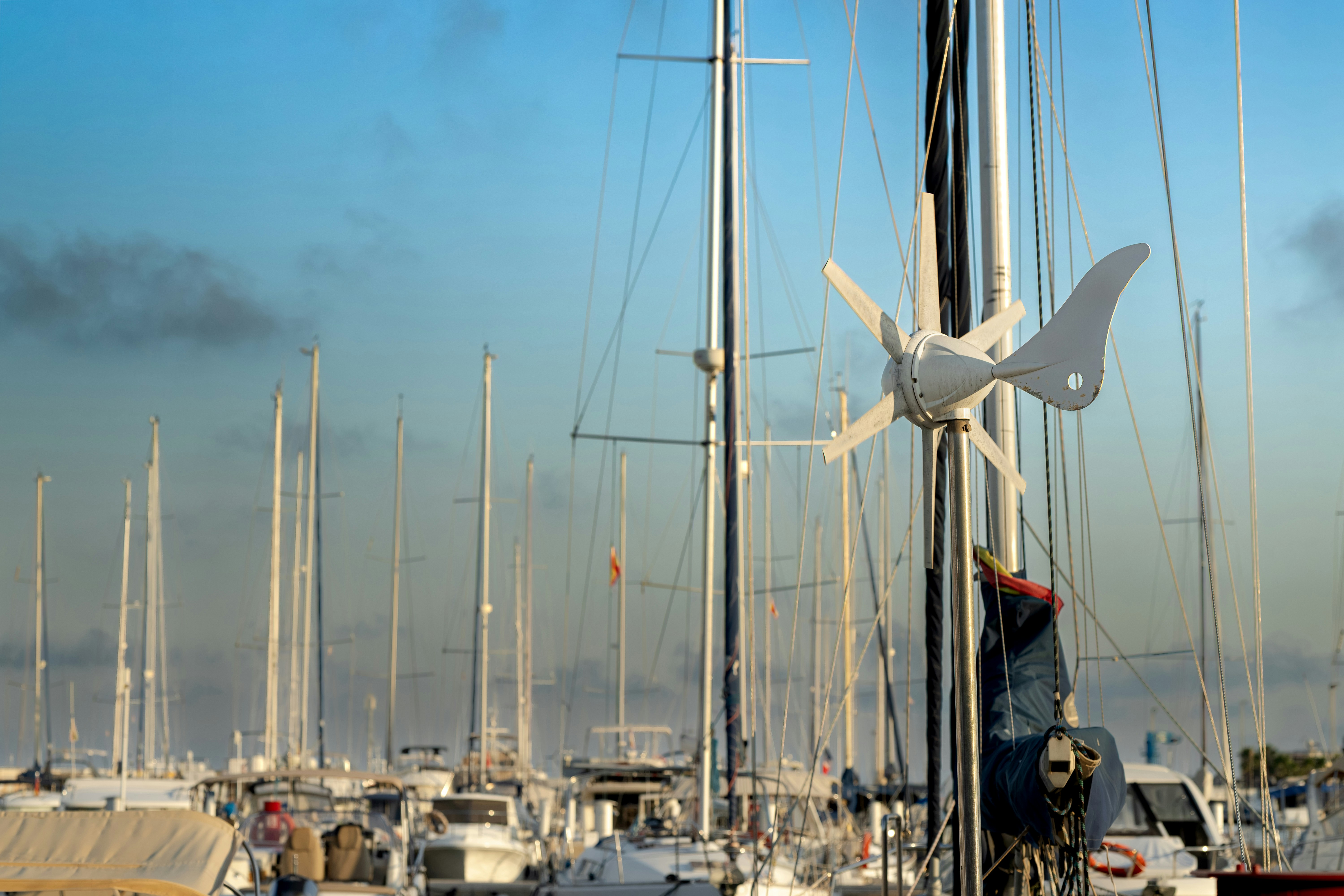 Sailboat Windmill at the Marina: A Quiet Harbor Moment