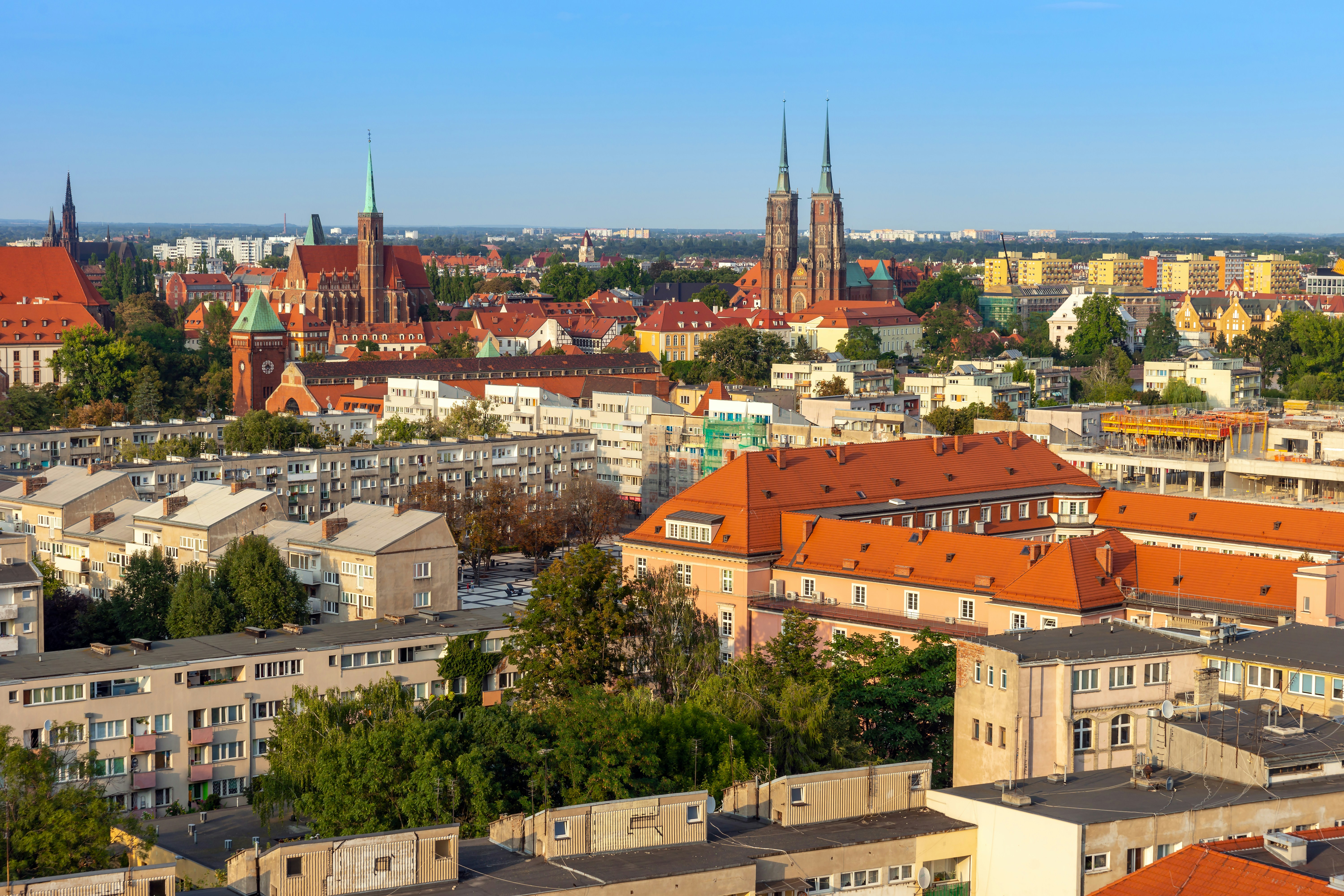 Red-Tiled Skyline Under a Clear Blue Dome