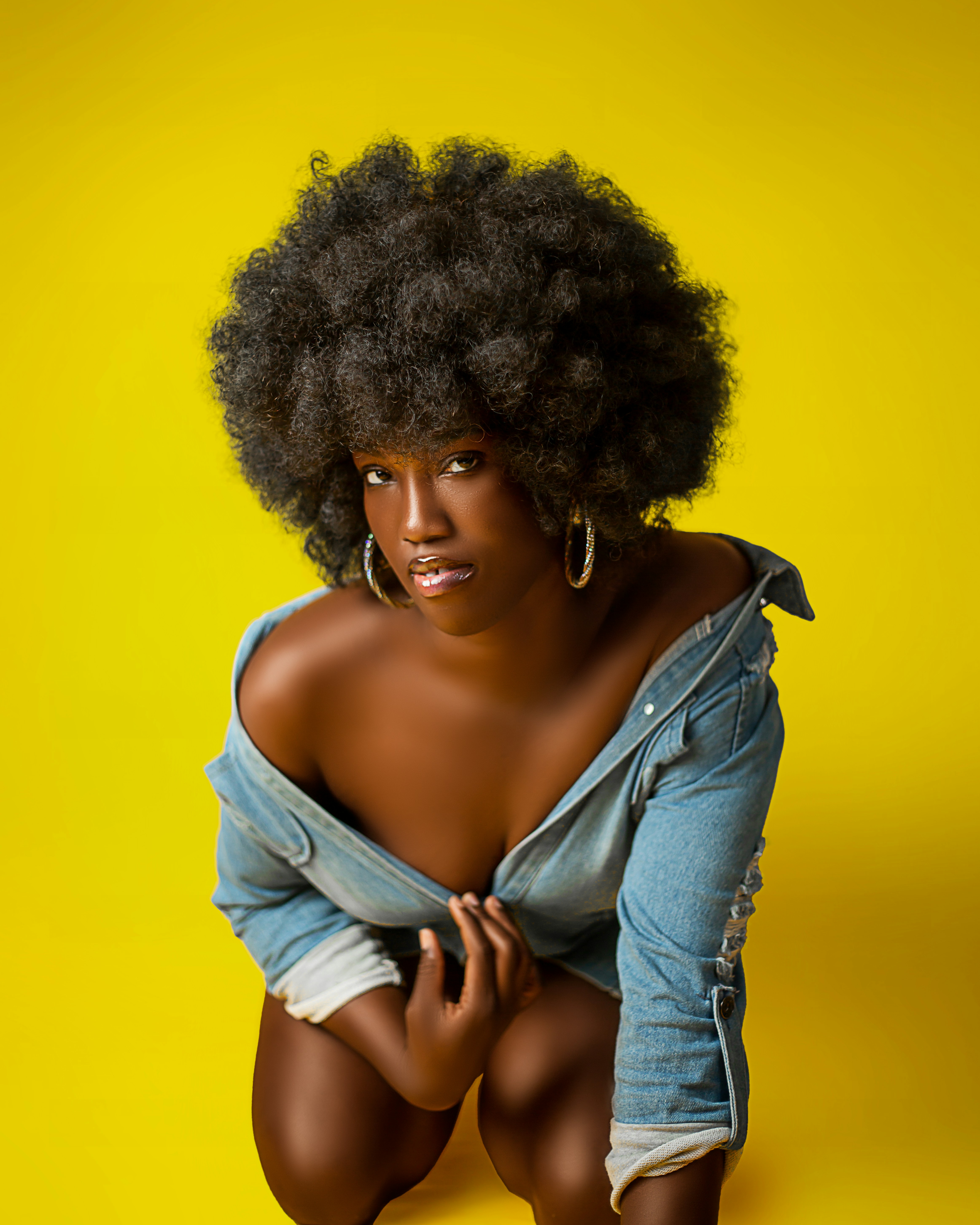 Vibrant Portrait: Confidence in a Yellow Studio
