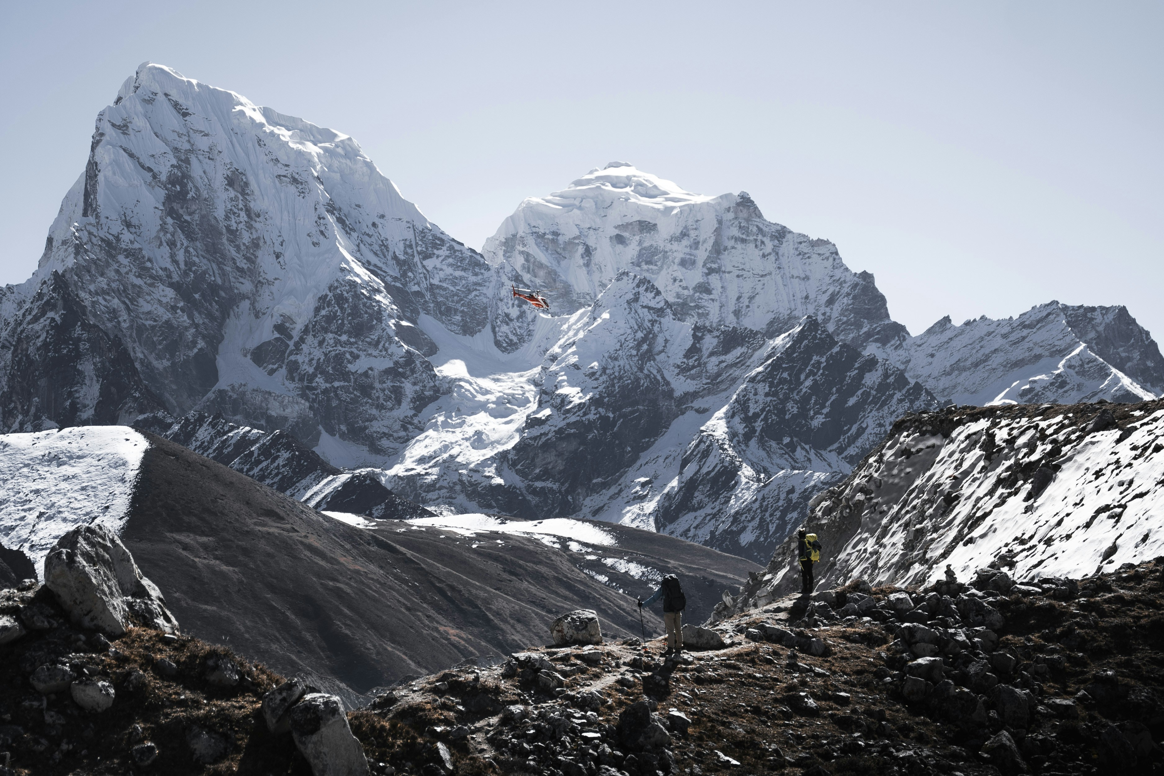 Rugged Ascent Beneath Icy Peaks