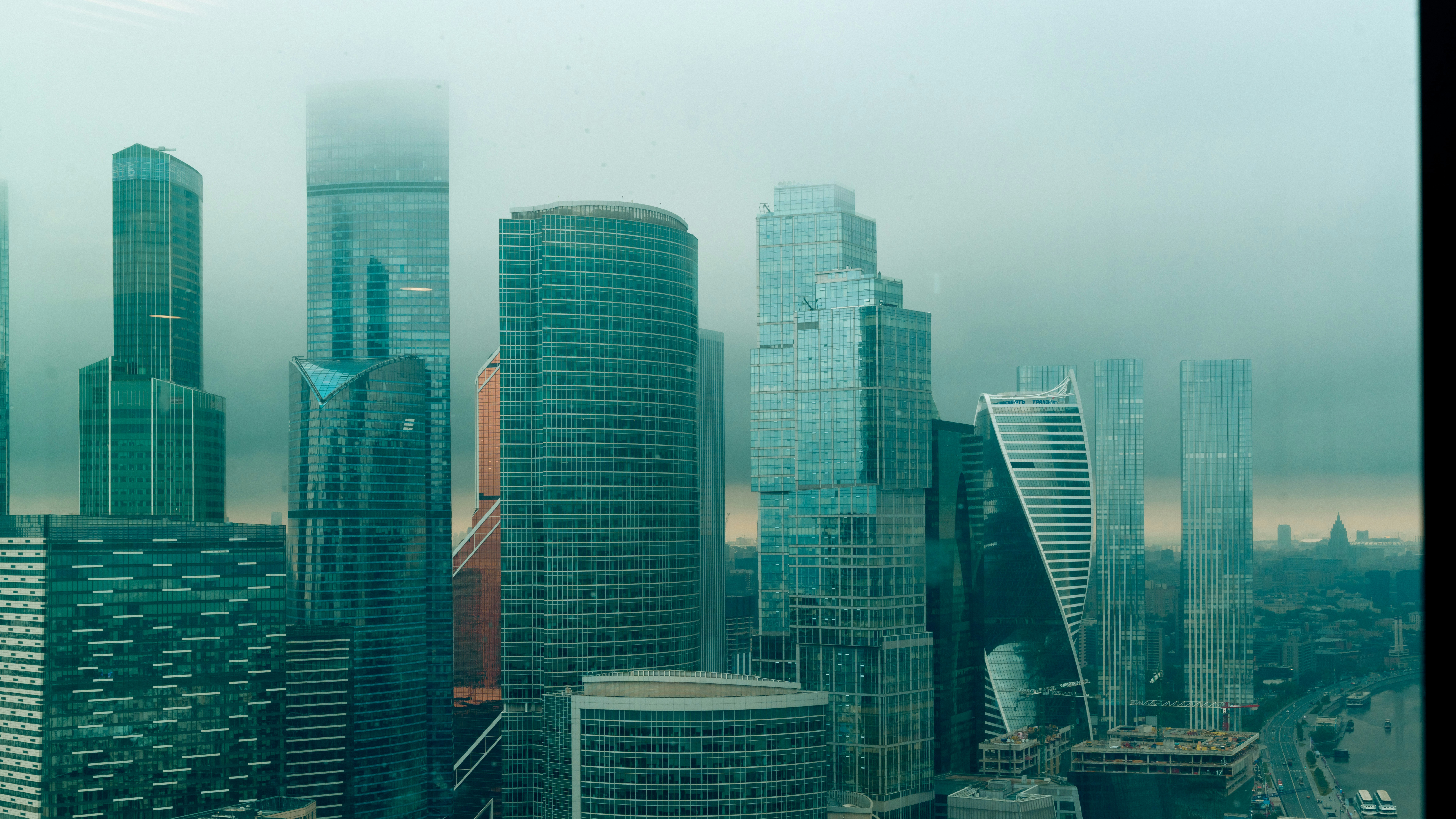 Glass Horizons: A City Summit in Mist