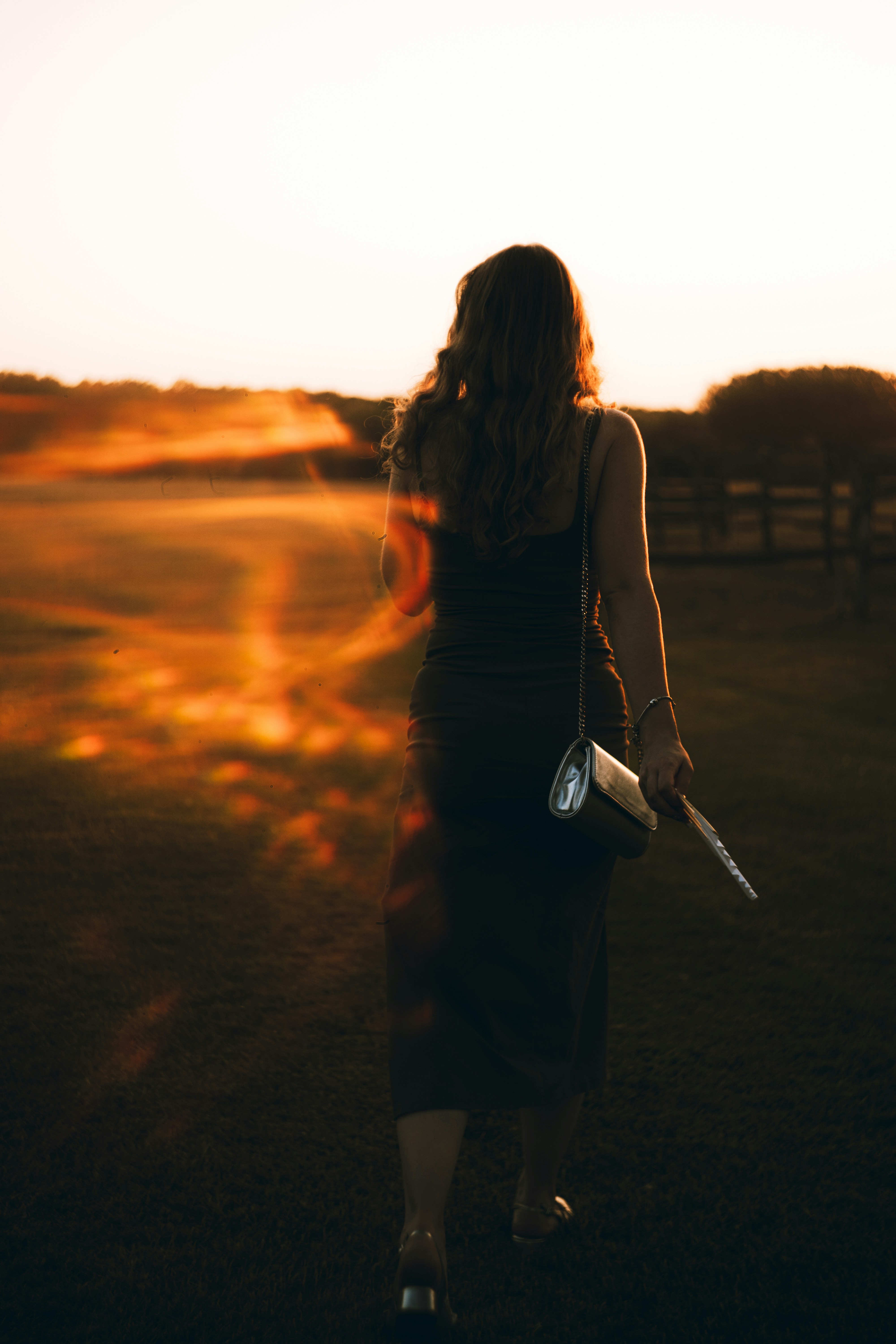 Backlit Evening Stroll with Silhouetted Figure