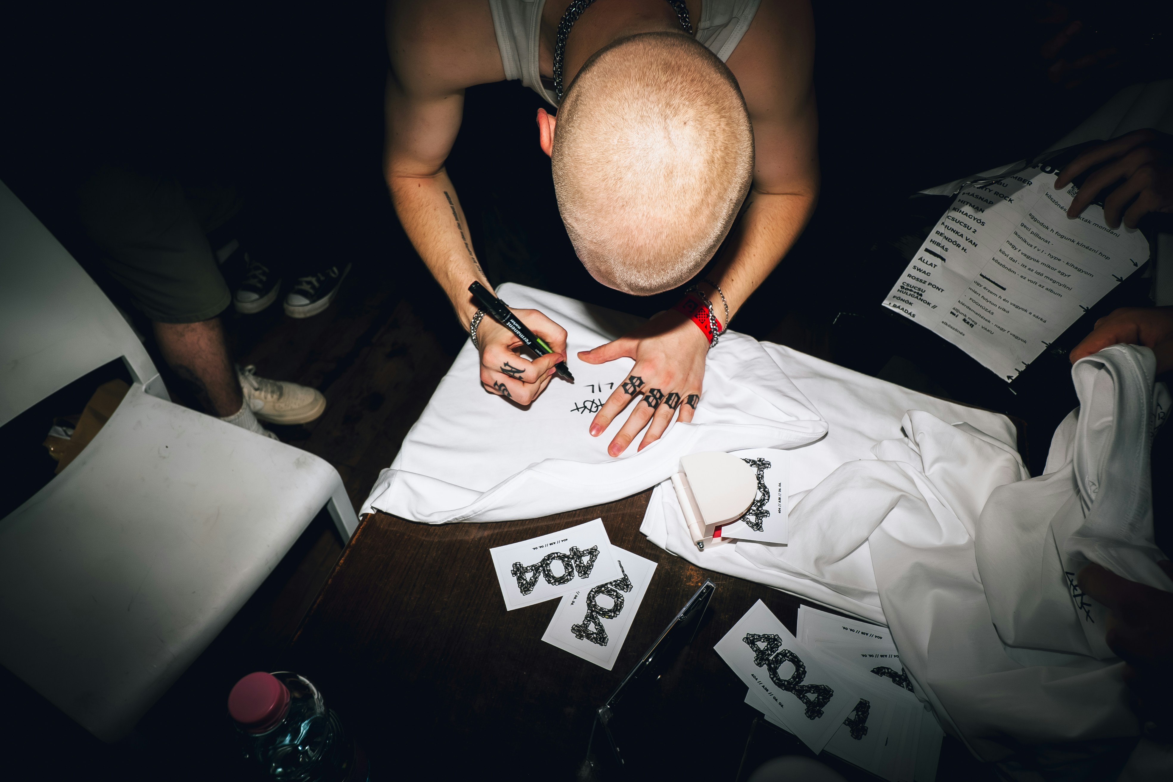 Midnight Signatures: A Bald Head Dips into Inked Pages
