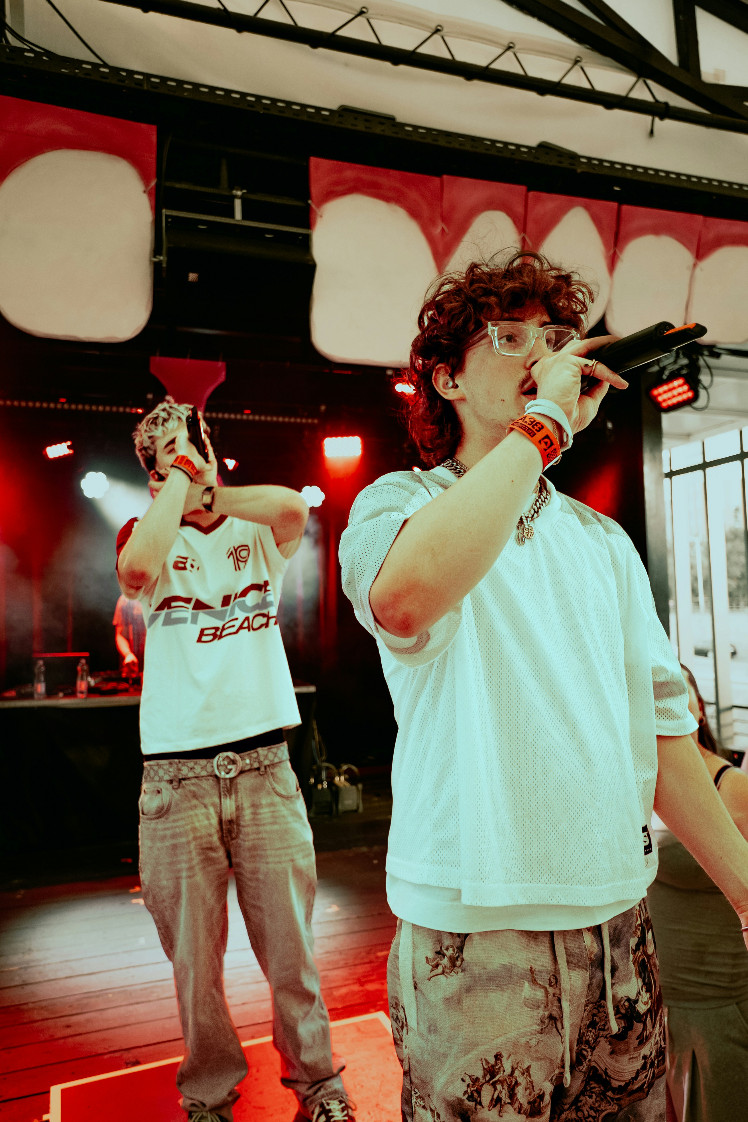 Frontman in White: A Live Performance Close-Up