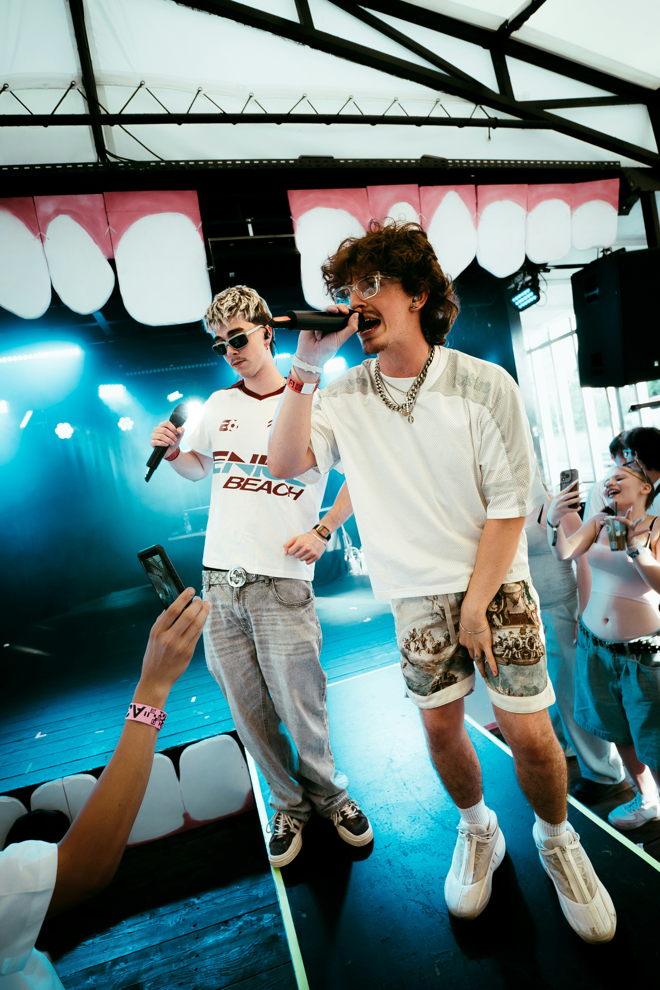 Stage Pulse: Duo of Voices under Neon Gaze