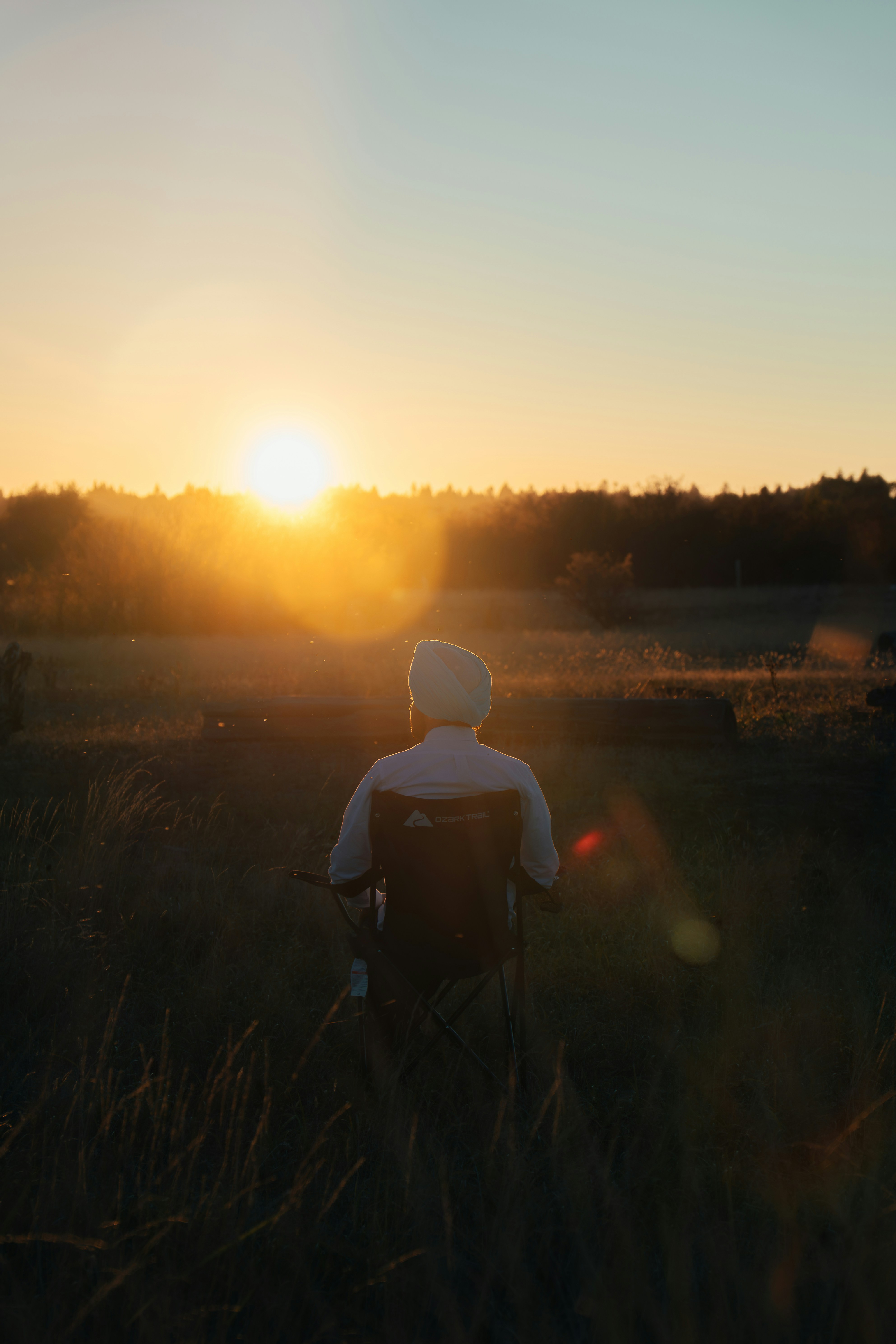 Sunset Reverie: A Figure in the Field Embraced by Golden Light