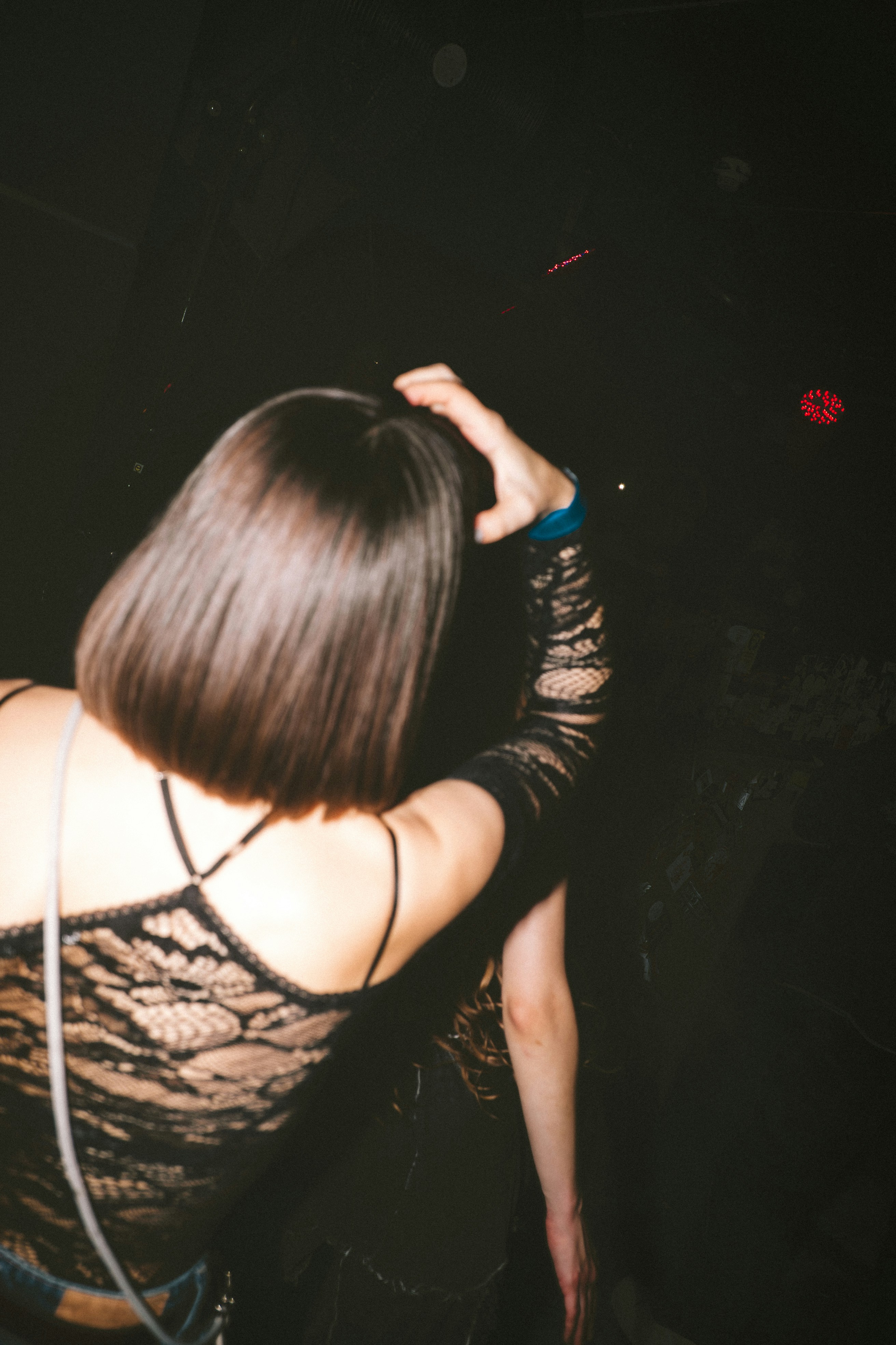 Backlit in Lace: A Nightclub Moment with a Silhouette of Style
