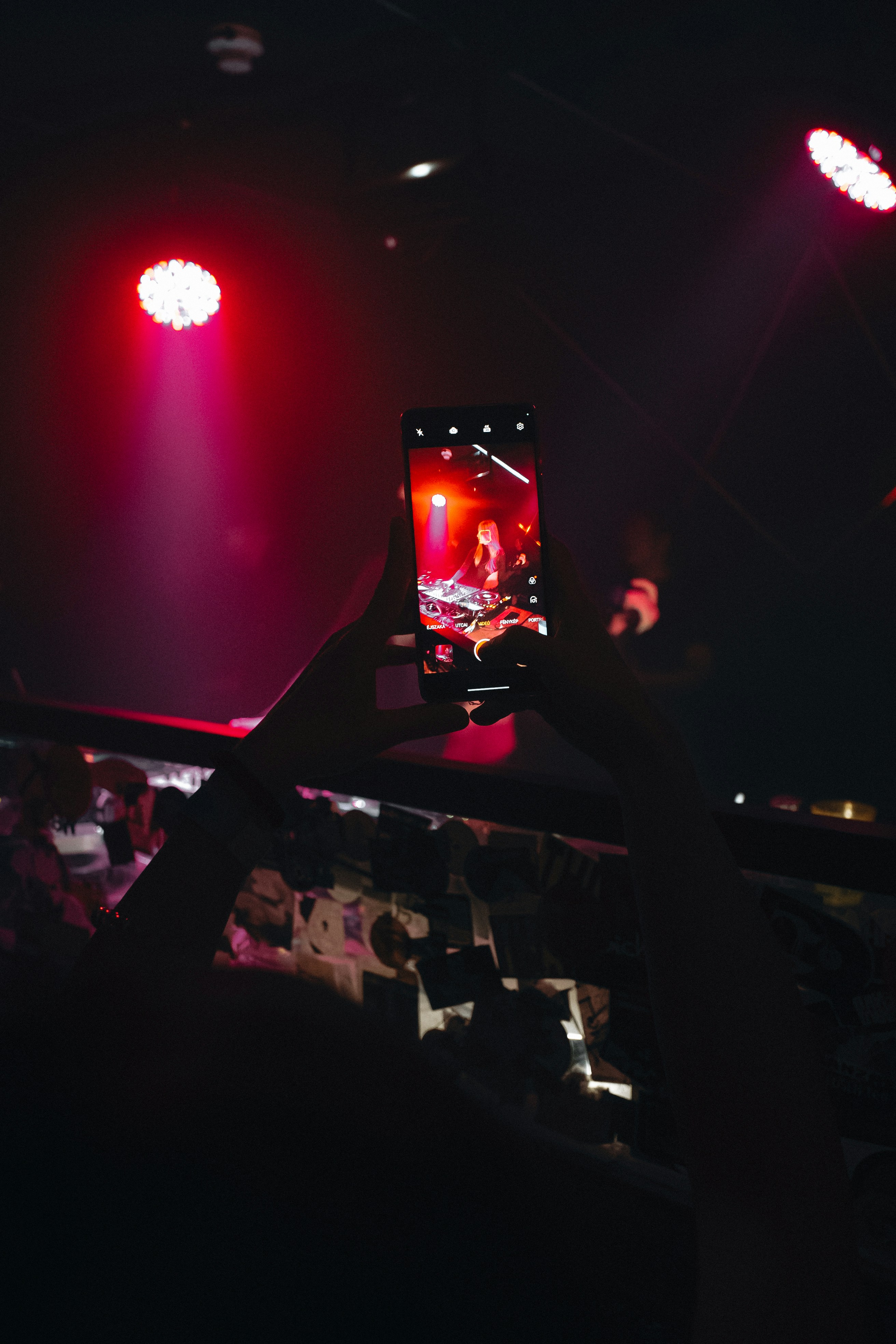 Phone Viewfinder: Capturing the DJ Pulse in a Neon Night