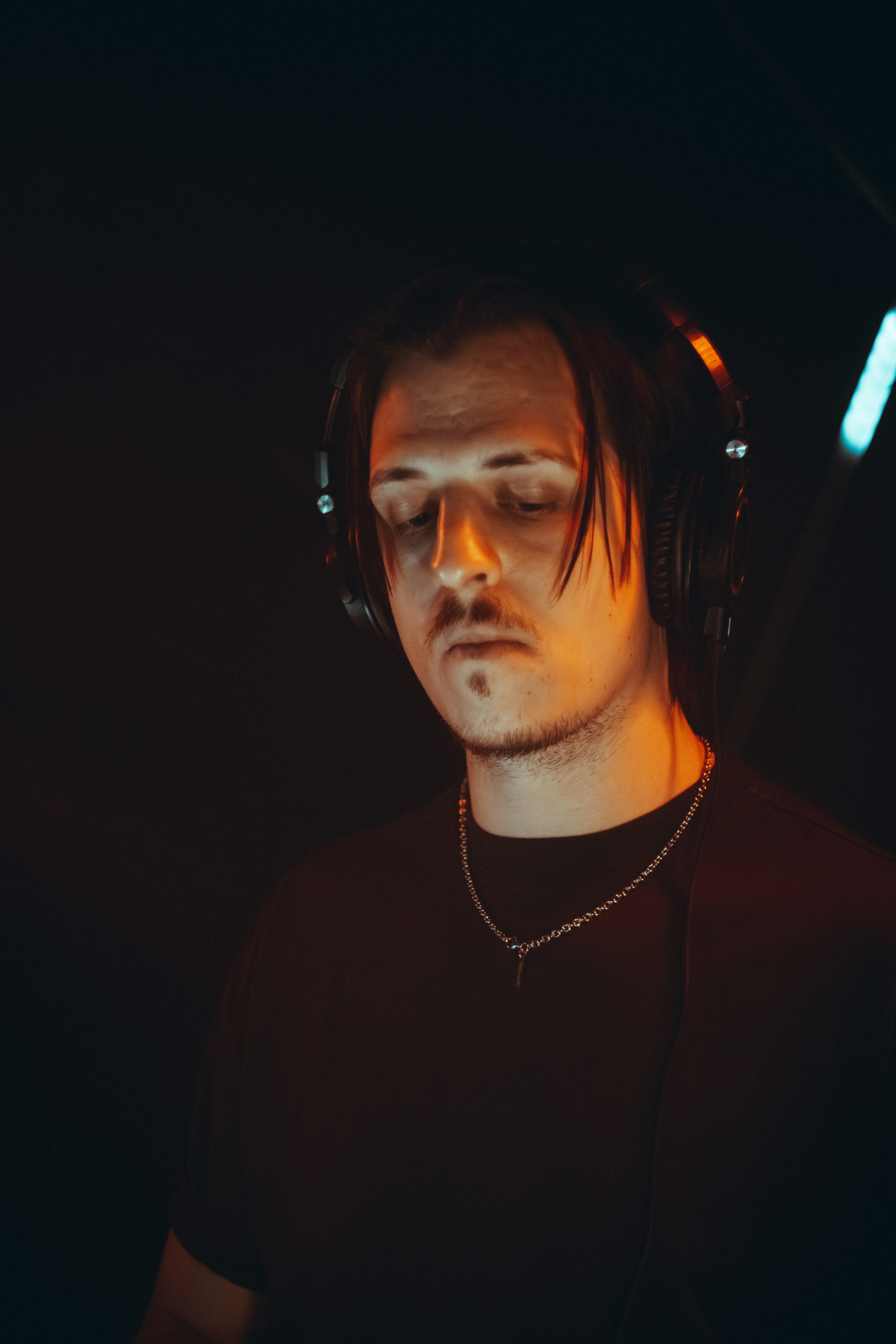 Headphones on, Focus Within: Night Studio Portrait