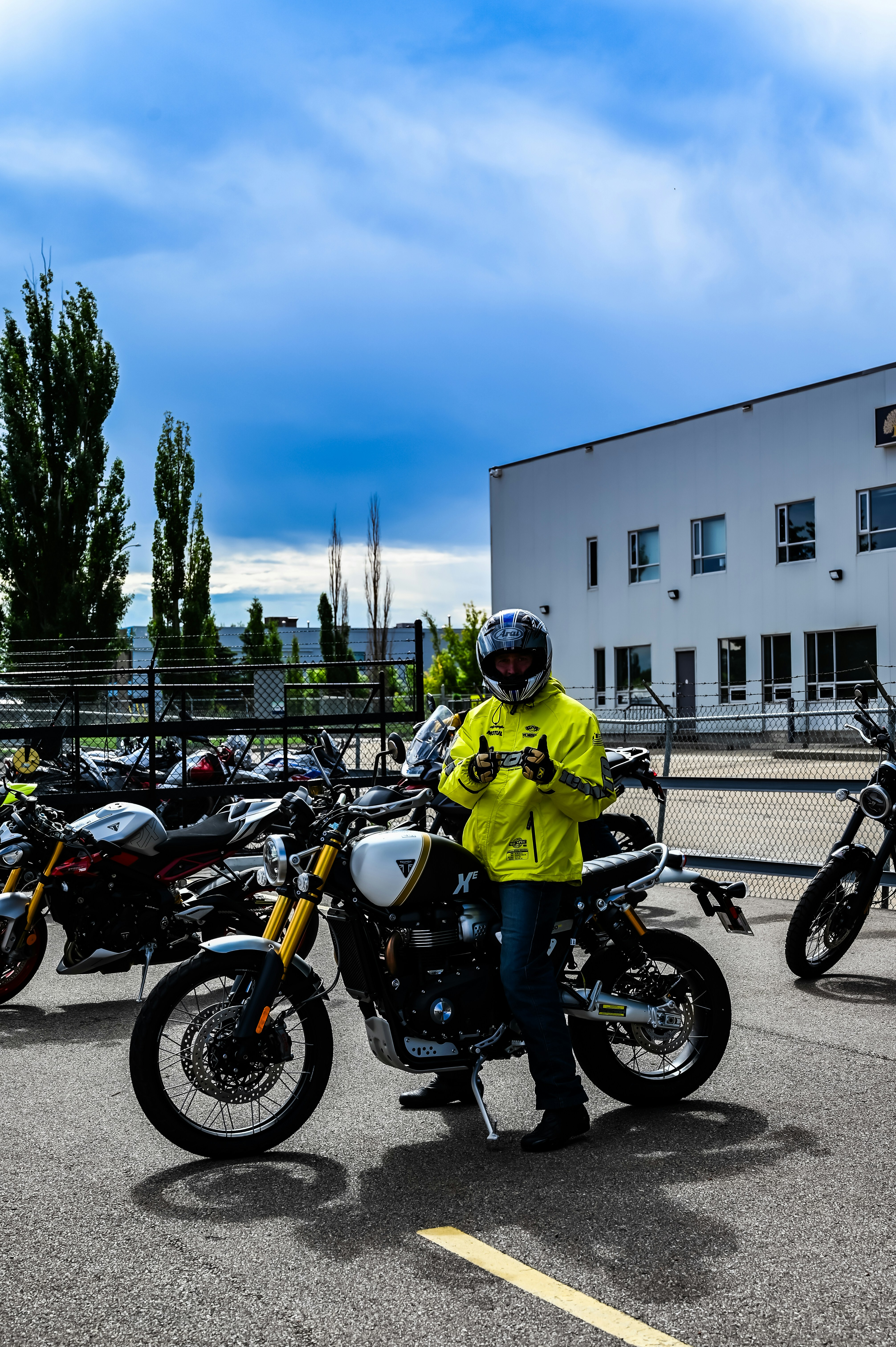 High-Vis Rider: Spotlight on a Neon Jacket in a Motorcycle Yard