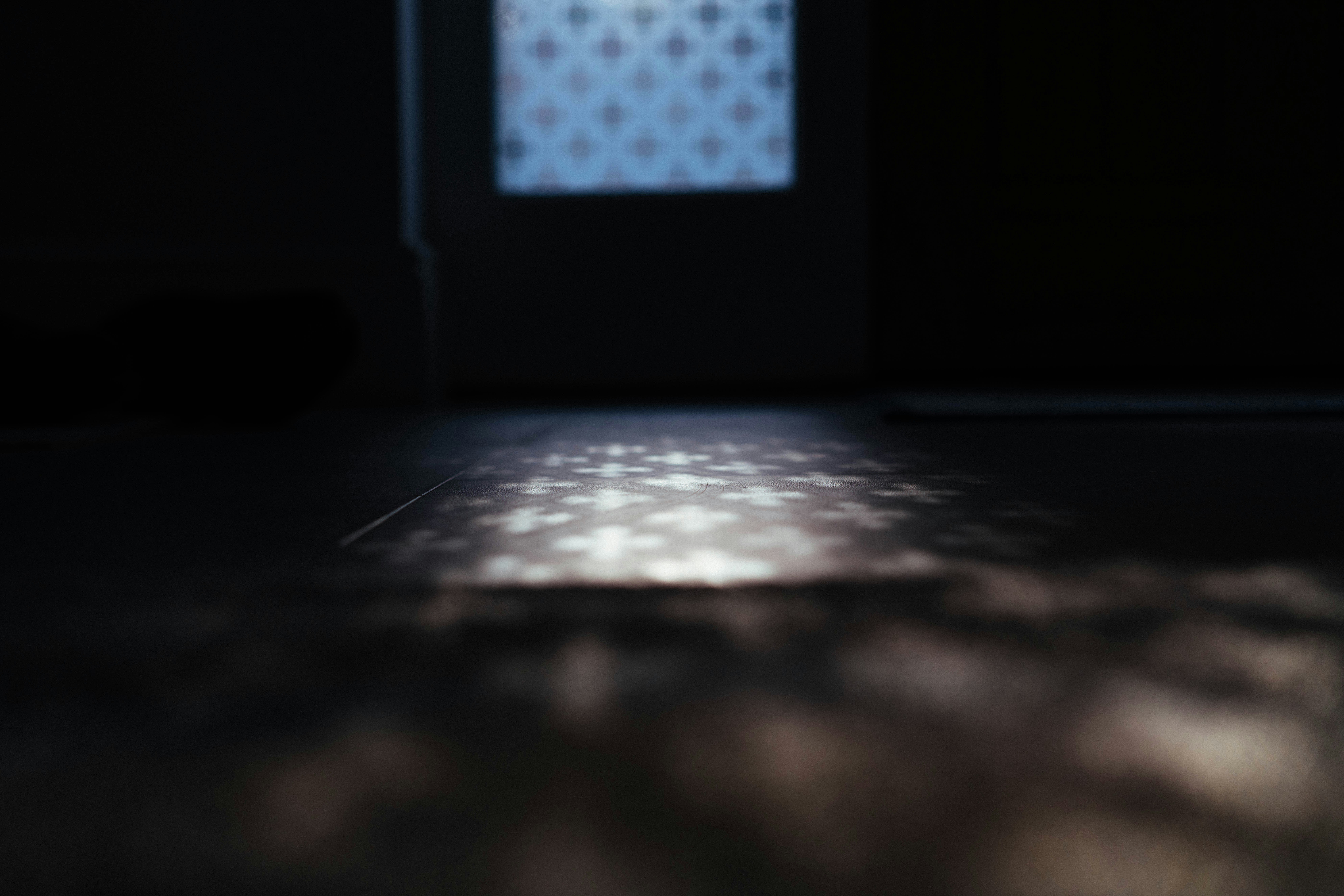 A Quiet Floor Illuminated by Distant Window Light