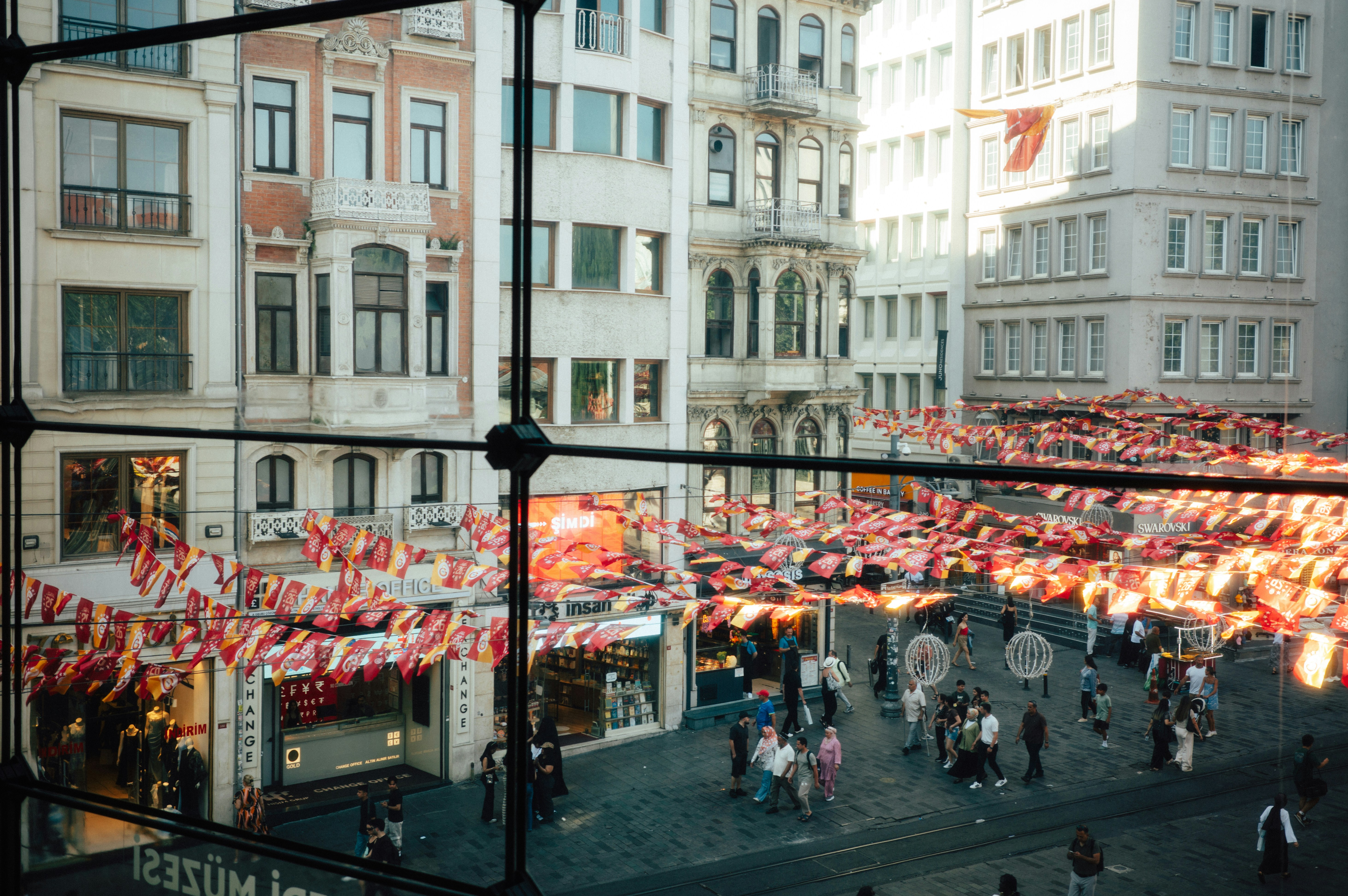 Festival Flags Over a Historic Street