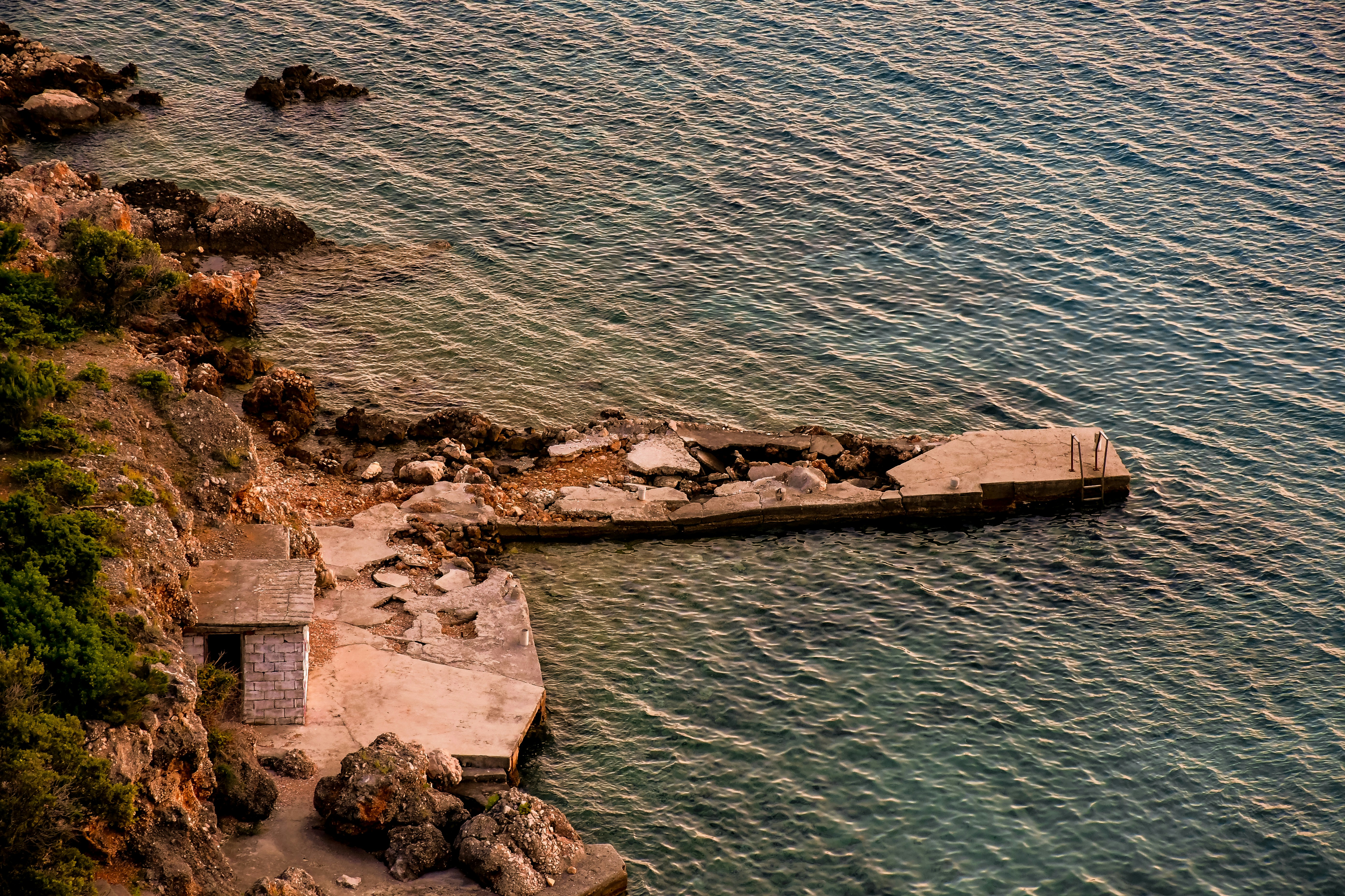 Coastal Jetty Reaches into Quiet Turquoise Waters