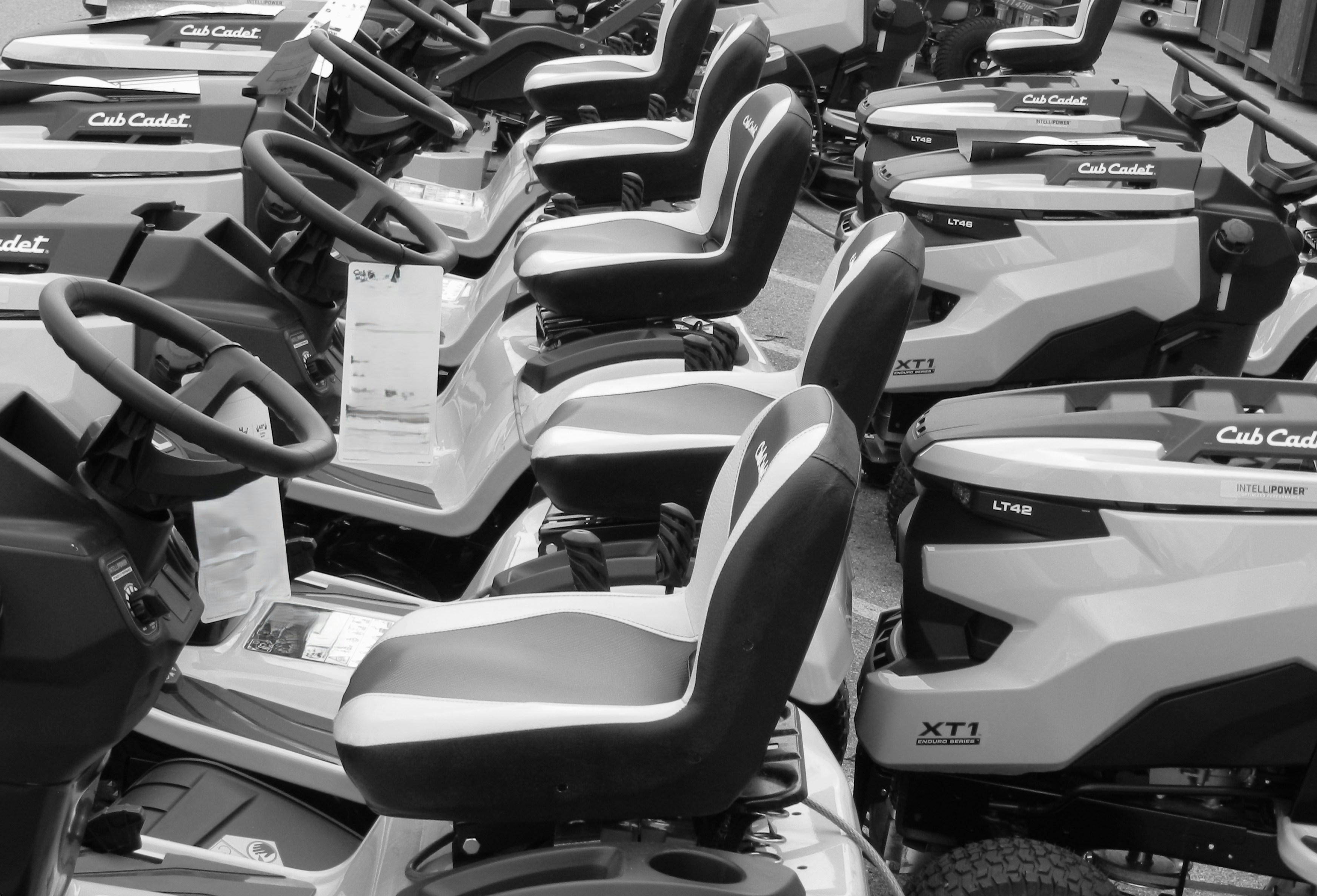 Staggered Row of Cub Cadet Seats: A Quiet Farm Machinery Gallery