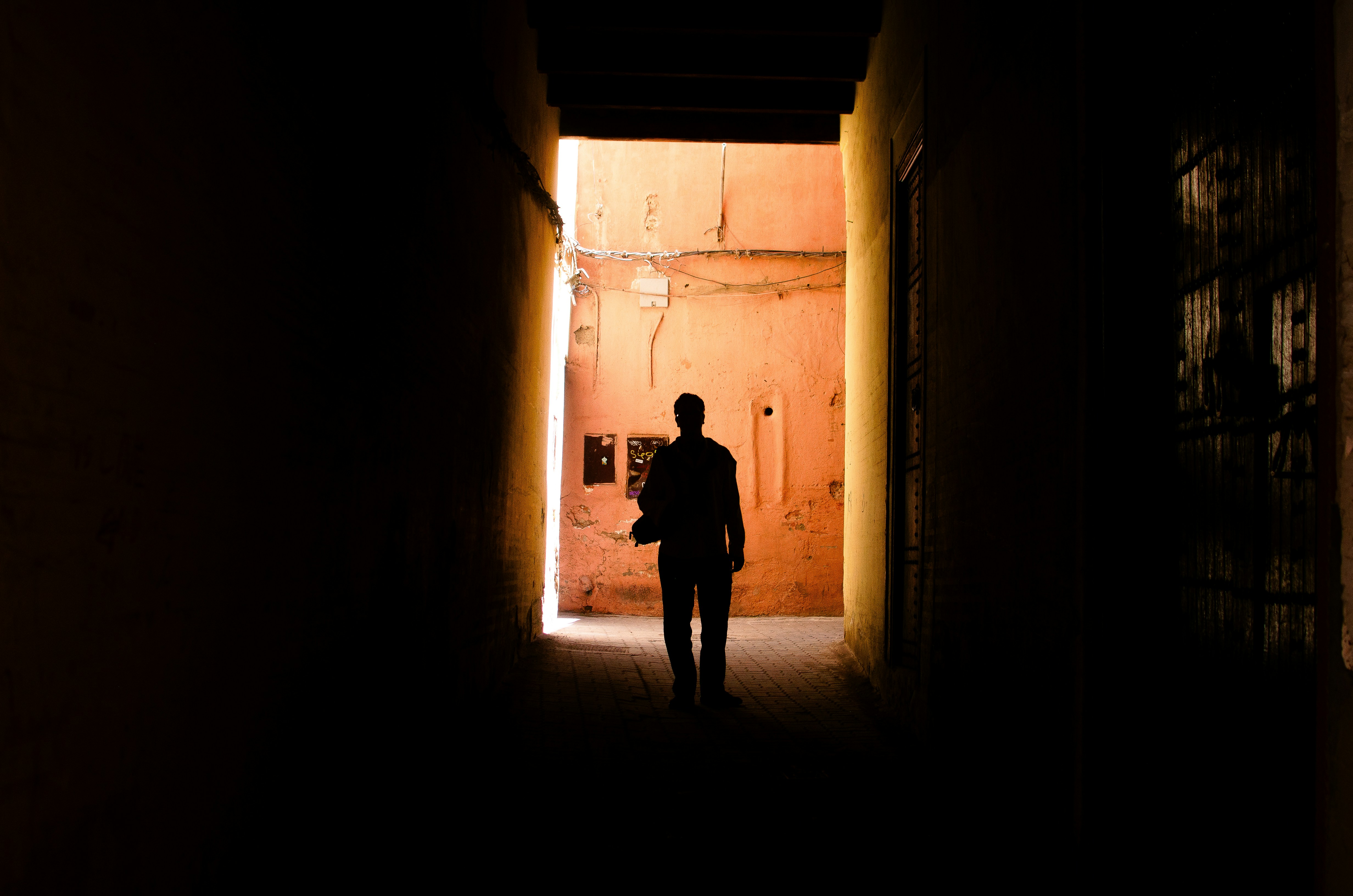 Silhouette in the Sunlit Alley