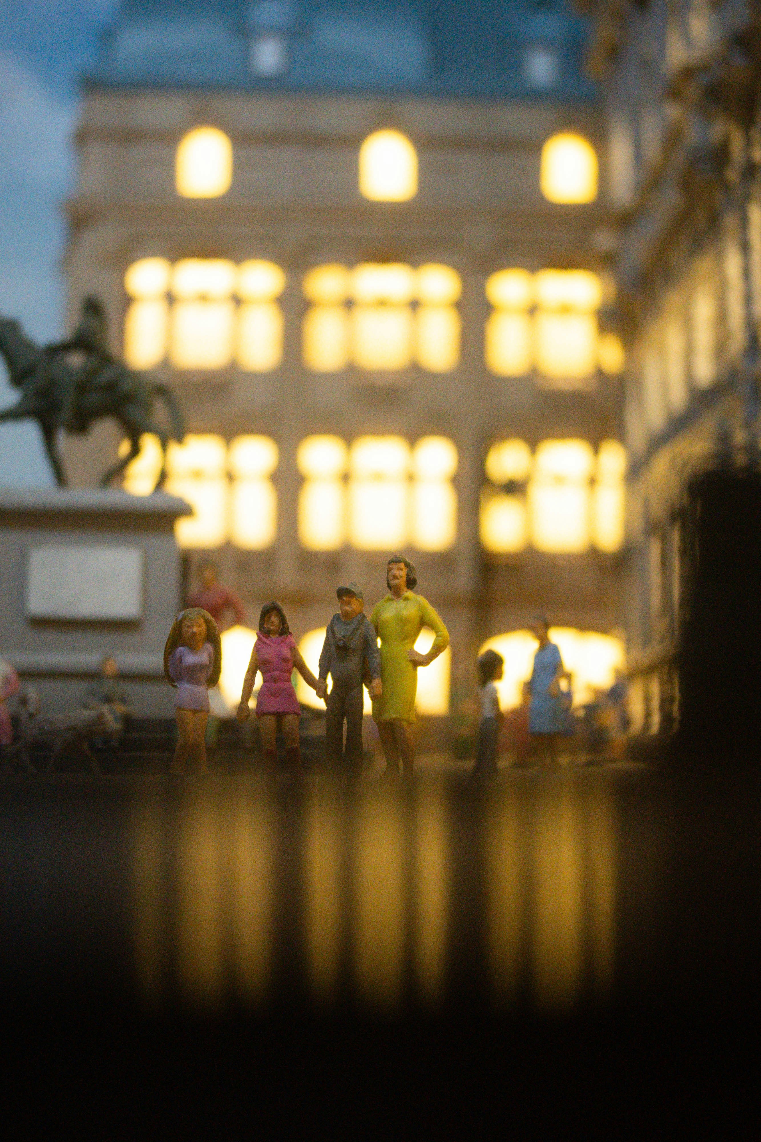 Miniature Crowd in a Warm-Backlit Courtyard