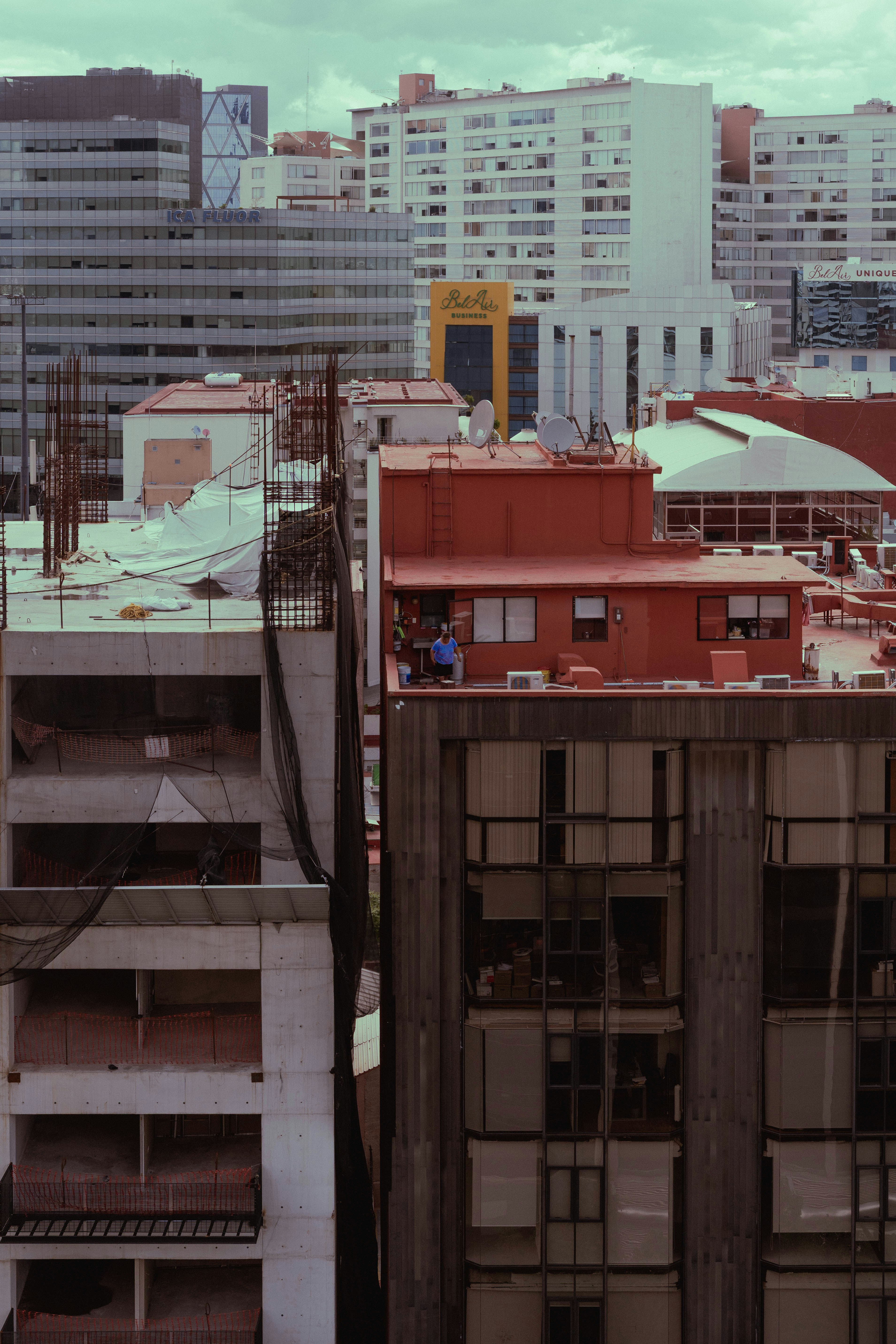 Rooftop Pulse: Urban Machinery Under a Tangerine Sky