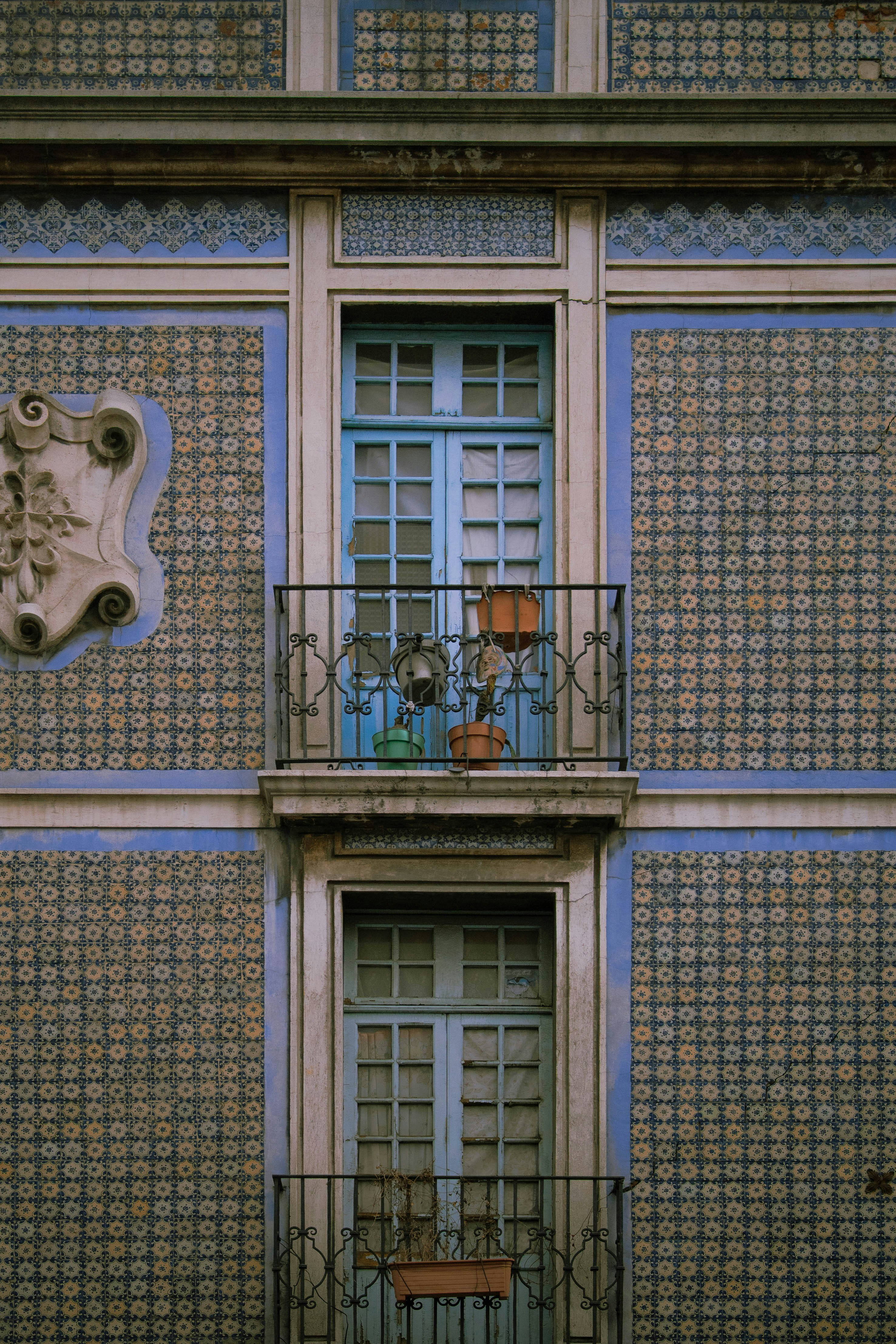 Tilework and Balconies: A Facade of Blue Portuguese Tiles
