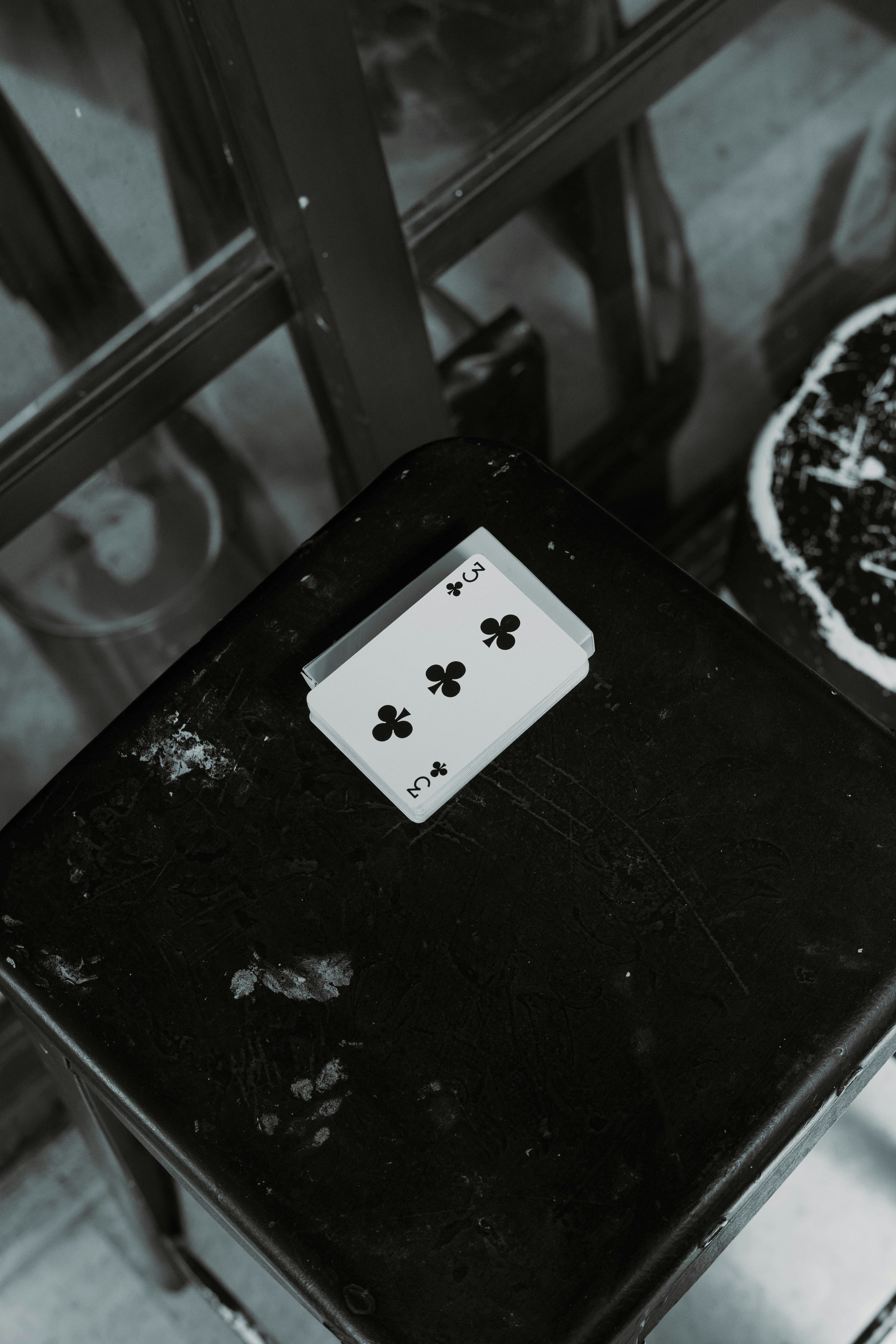 Five of Clubs: A Blackjack Card Resting on a Weathered Table