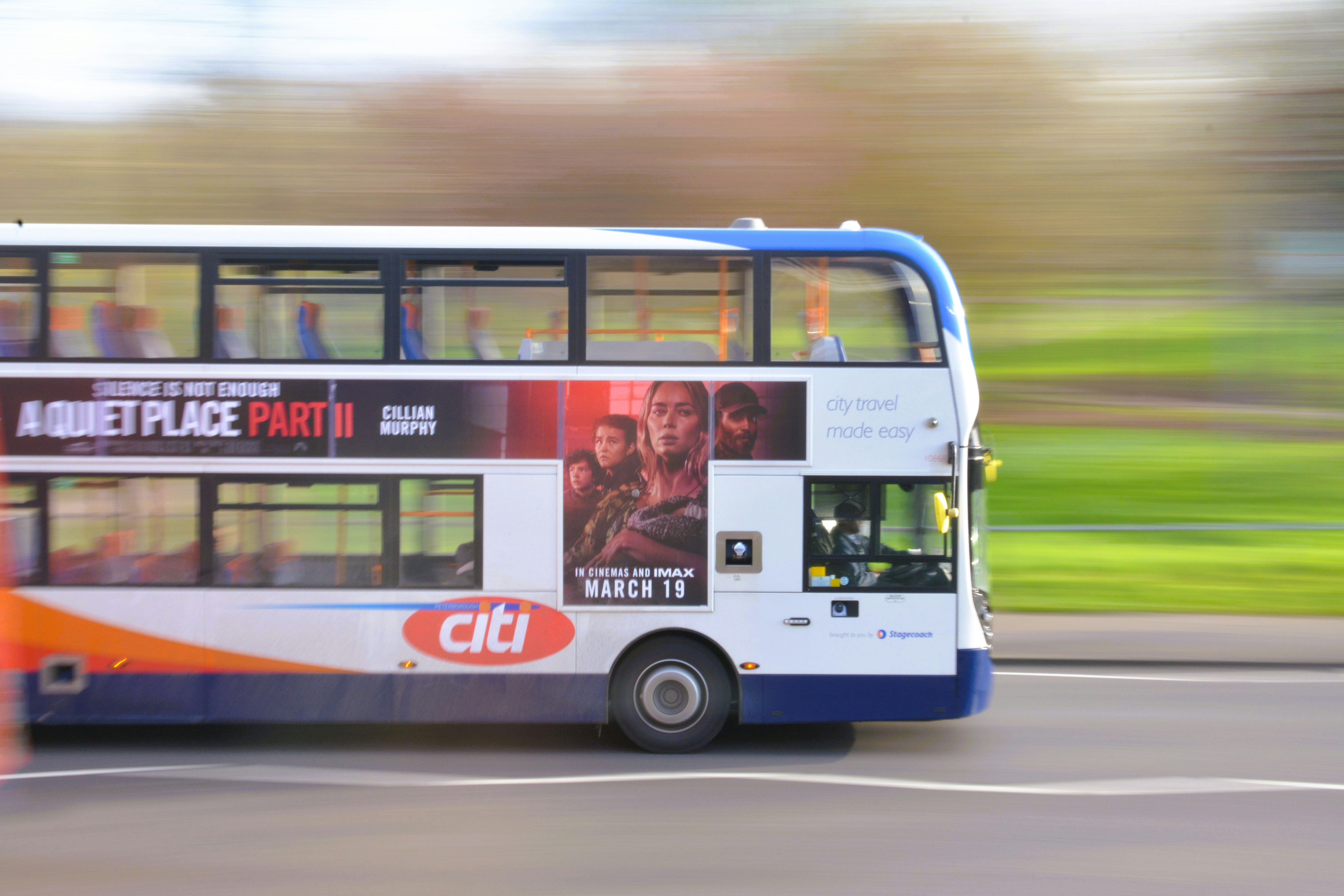 Motion Blur Meets City Transit: A Bus in Flight Across a Blurred Landscape