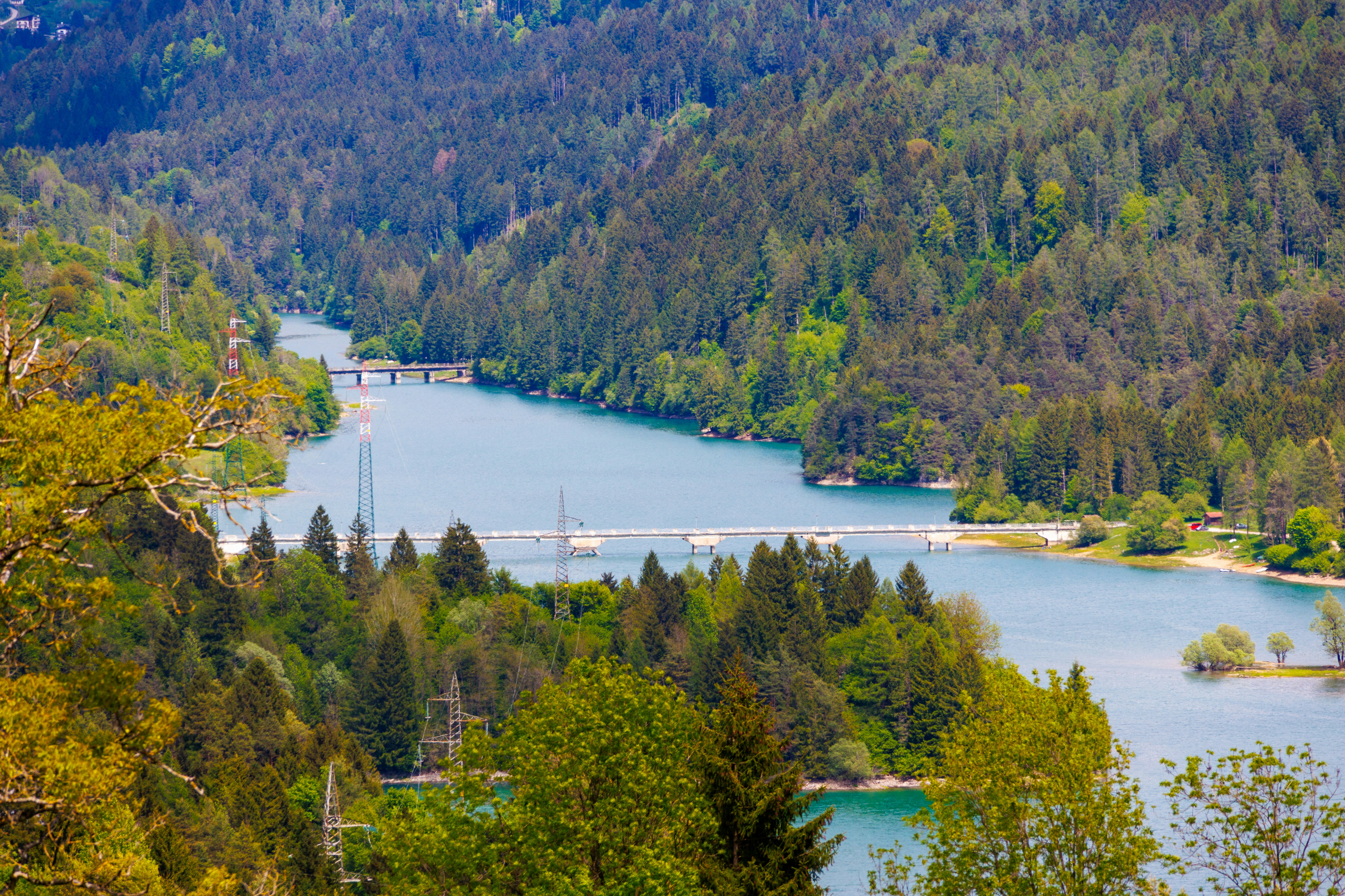 Luminous River Corridor Framed by Verdant Hills