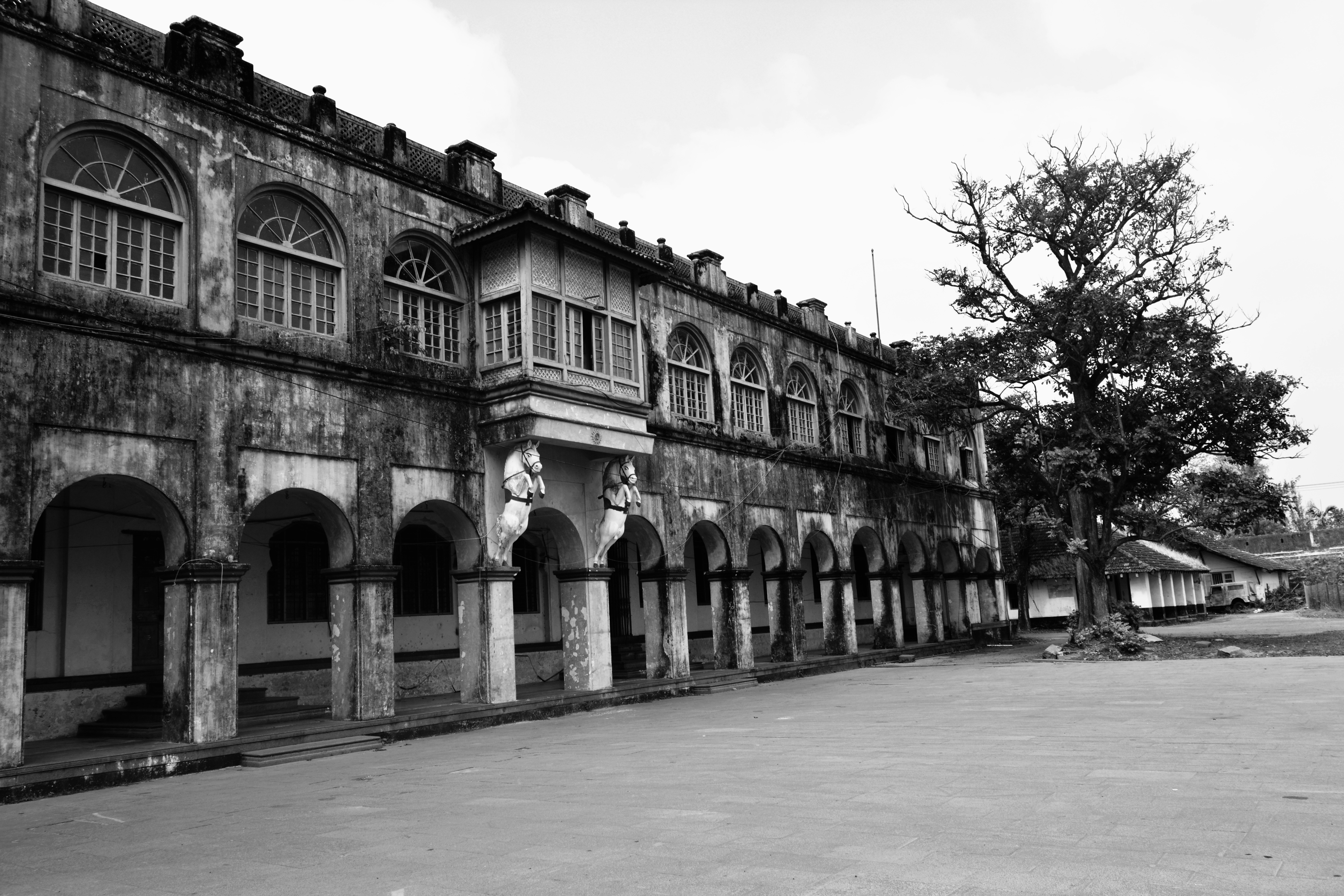 Lonely Arcade: Time-Worn Facades of a Monochrome Courtyard