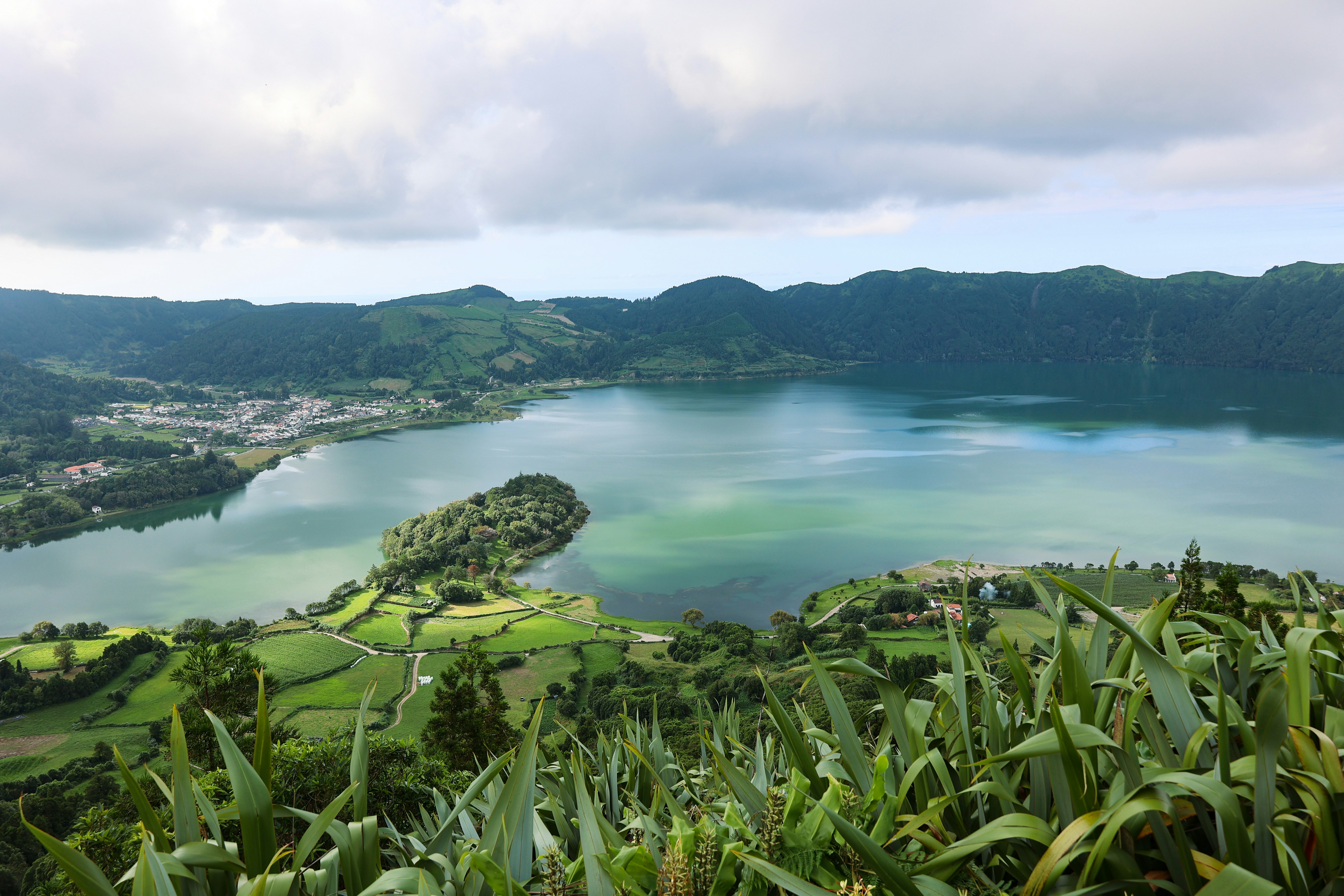 Aerial Green Rim: Tea-terraced Lake Panorama