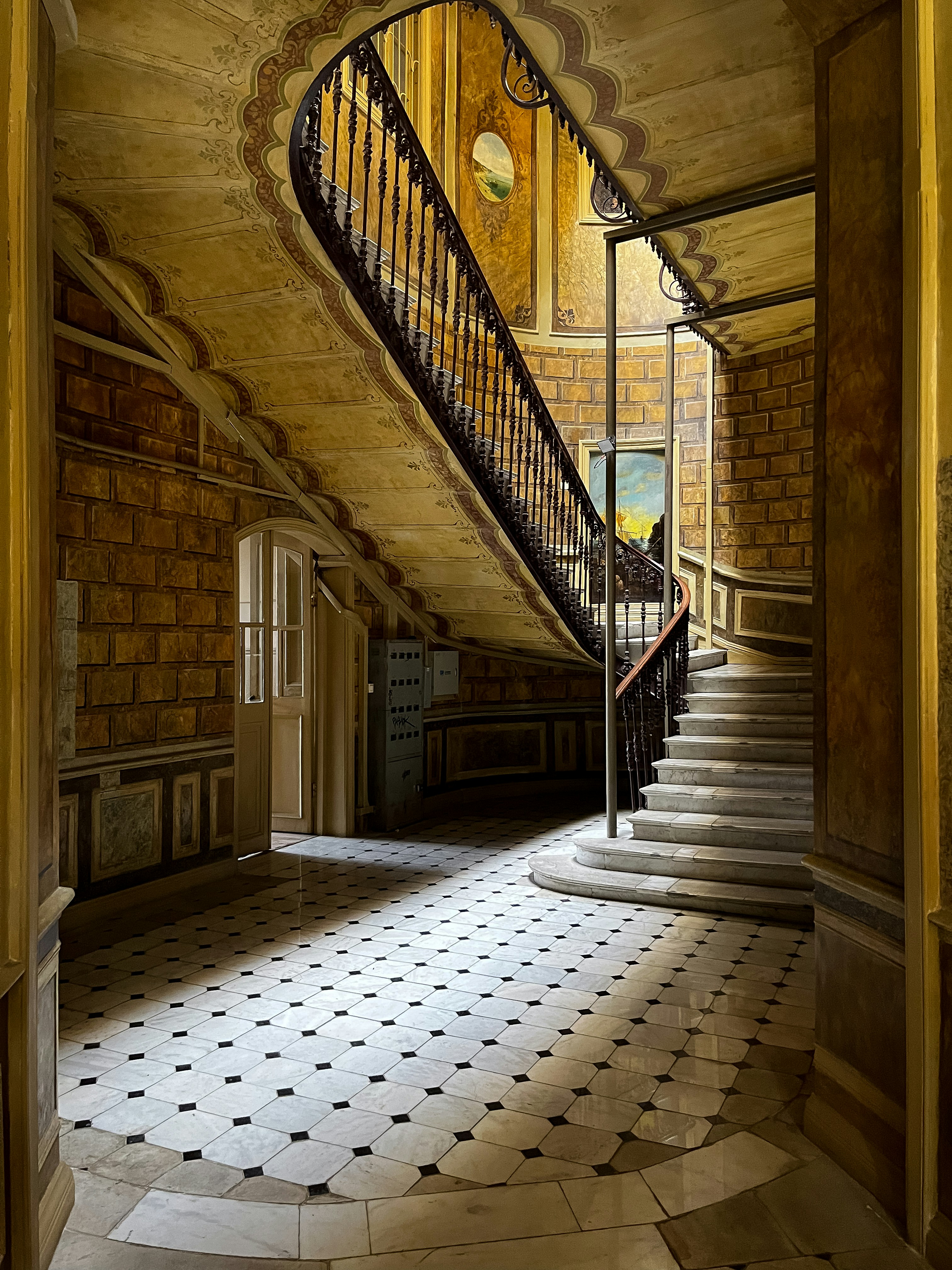 Grand Stairs and Arching Corridor in an Antique Interior