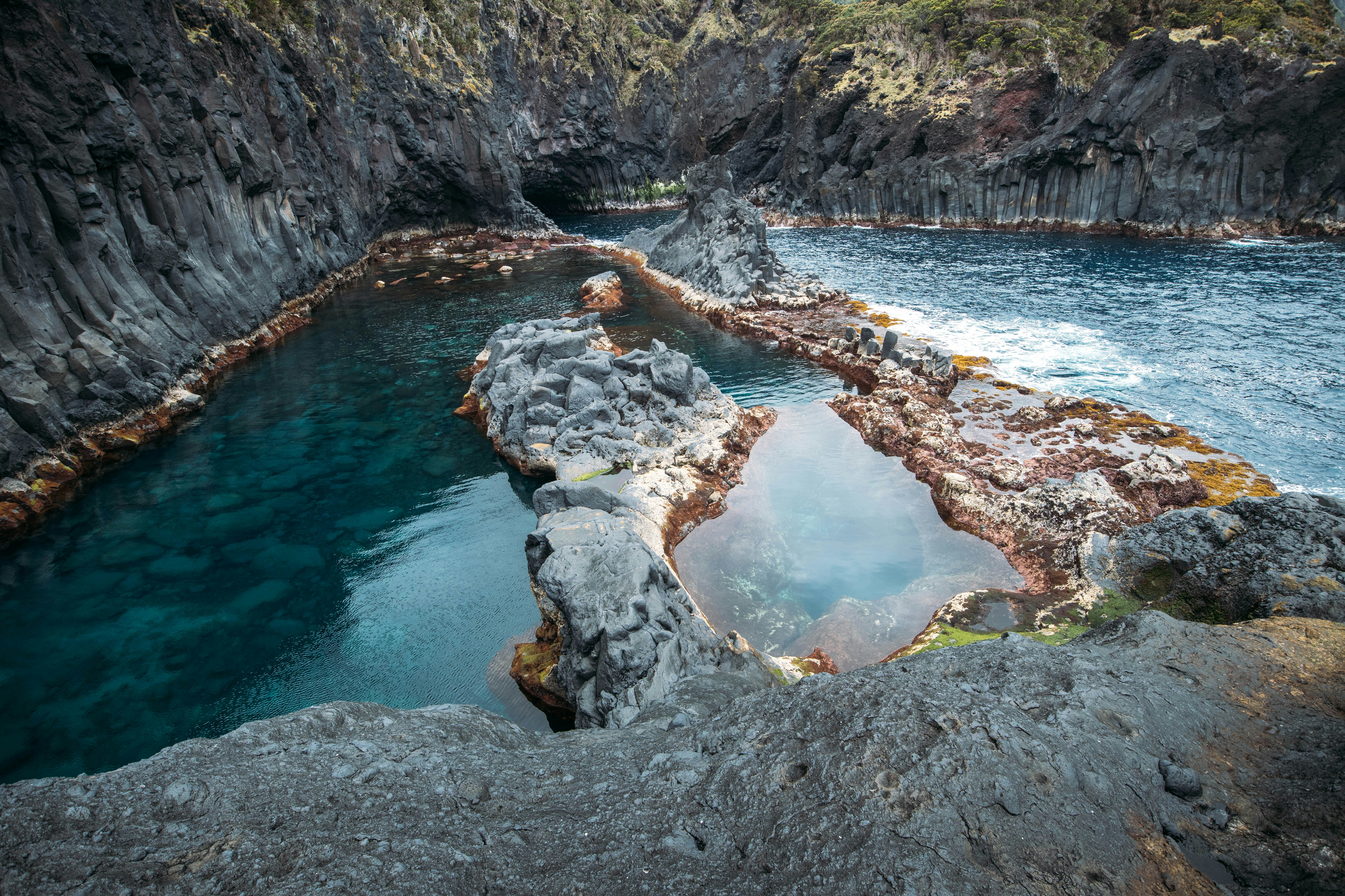 Hidden Tide Pool Between Weathered Cliffs