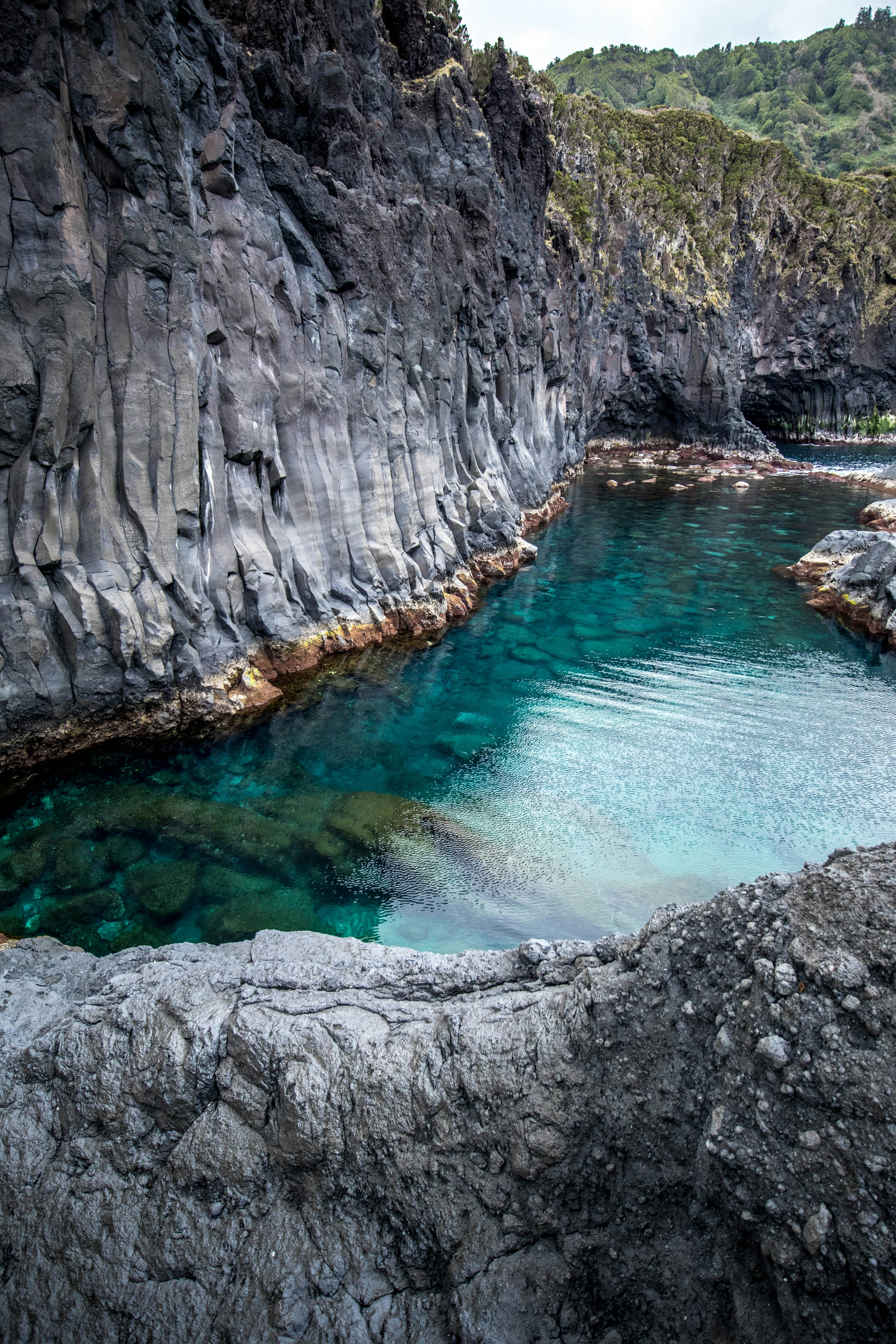 Azure Pool Carved in Basalt Walls by Quiet Shore