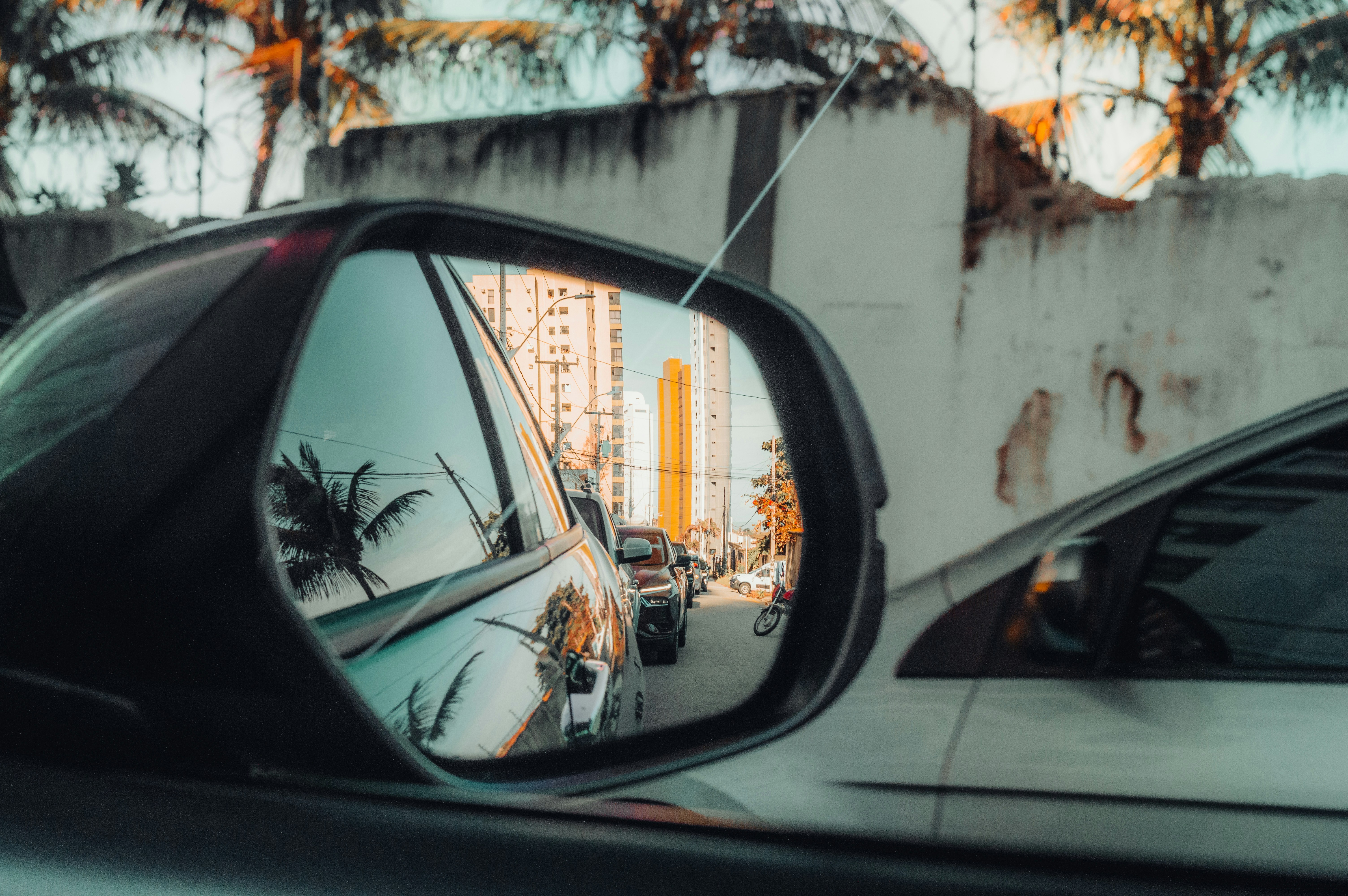 City Reflections in a Car’s Side Mirror