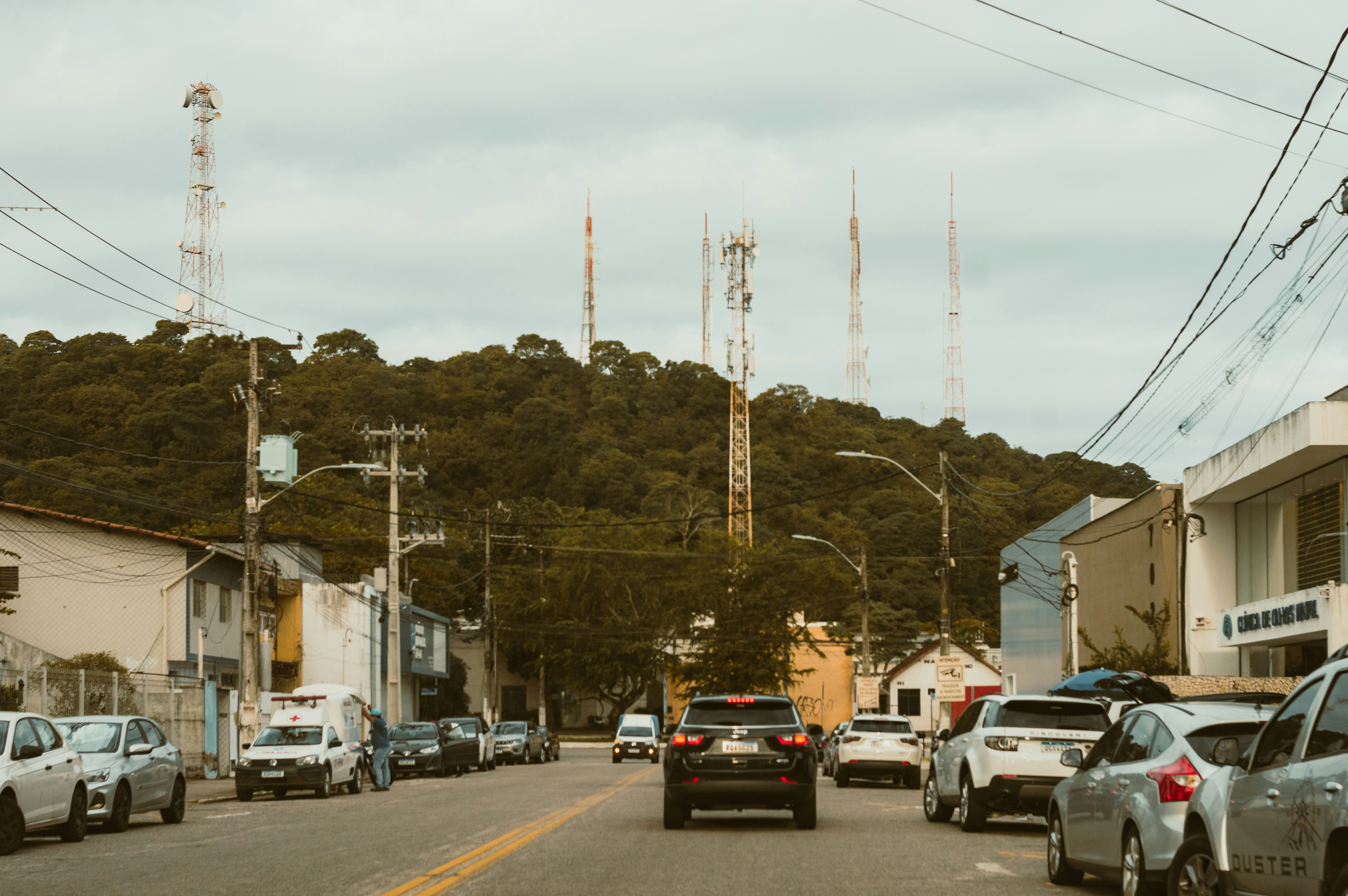 Urban Roadway Convergence: Cars, Power Lines, and a Climbing Ridge