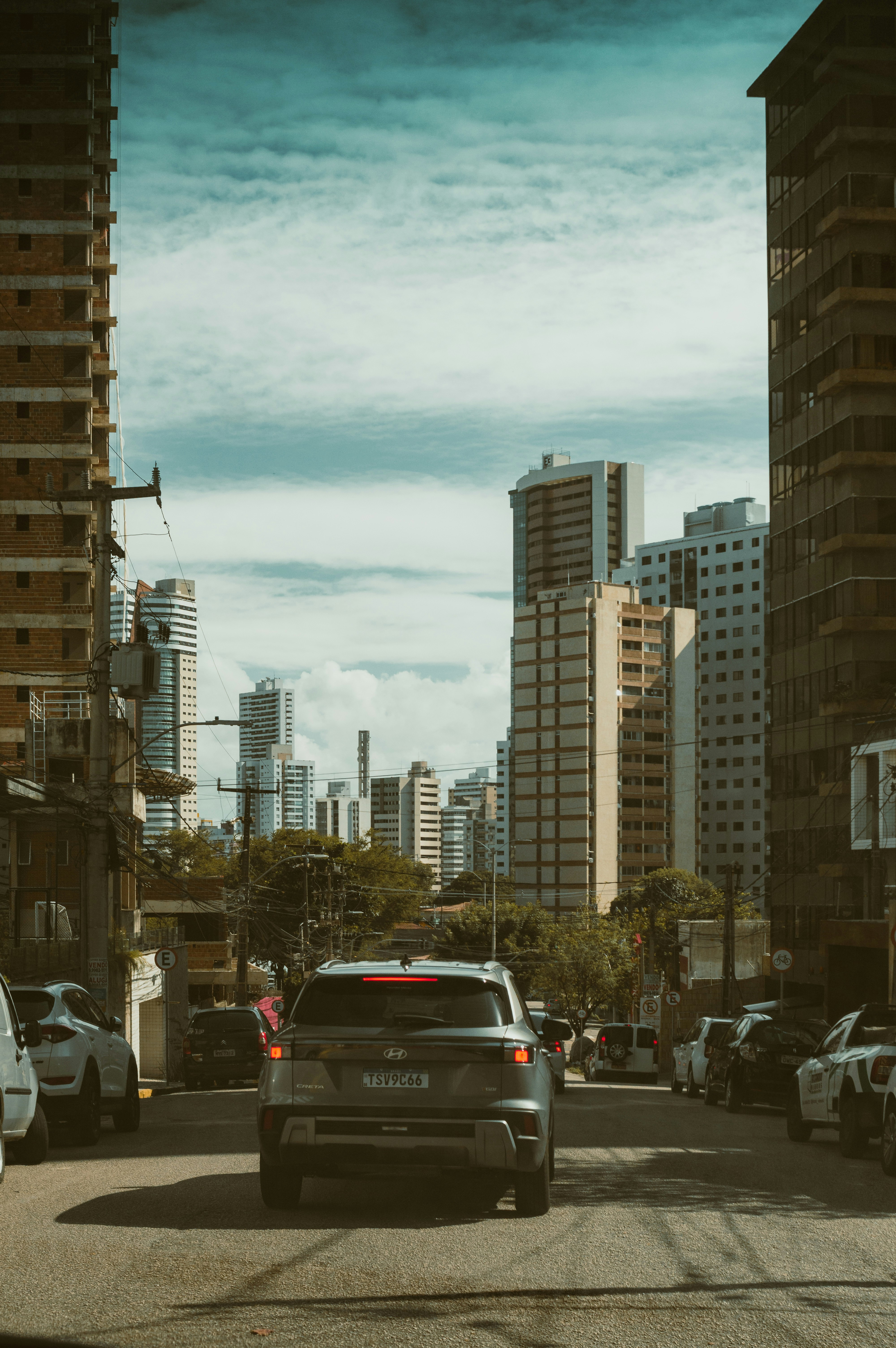 Urban Skyline Framed by Street Traffic