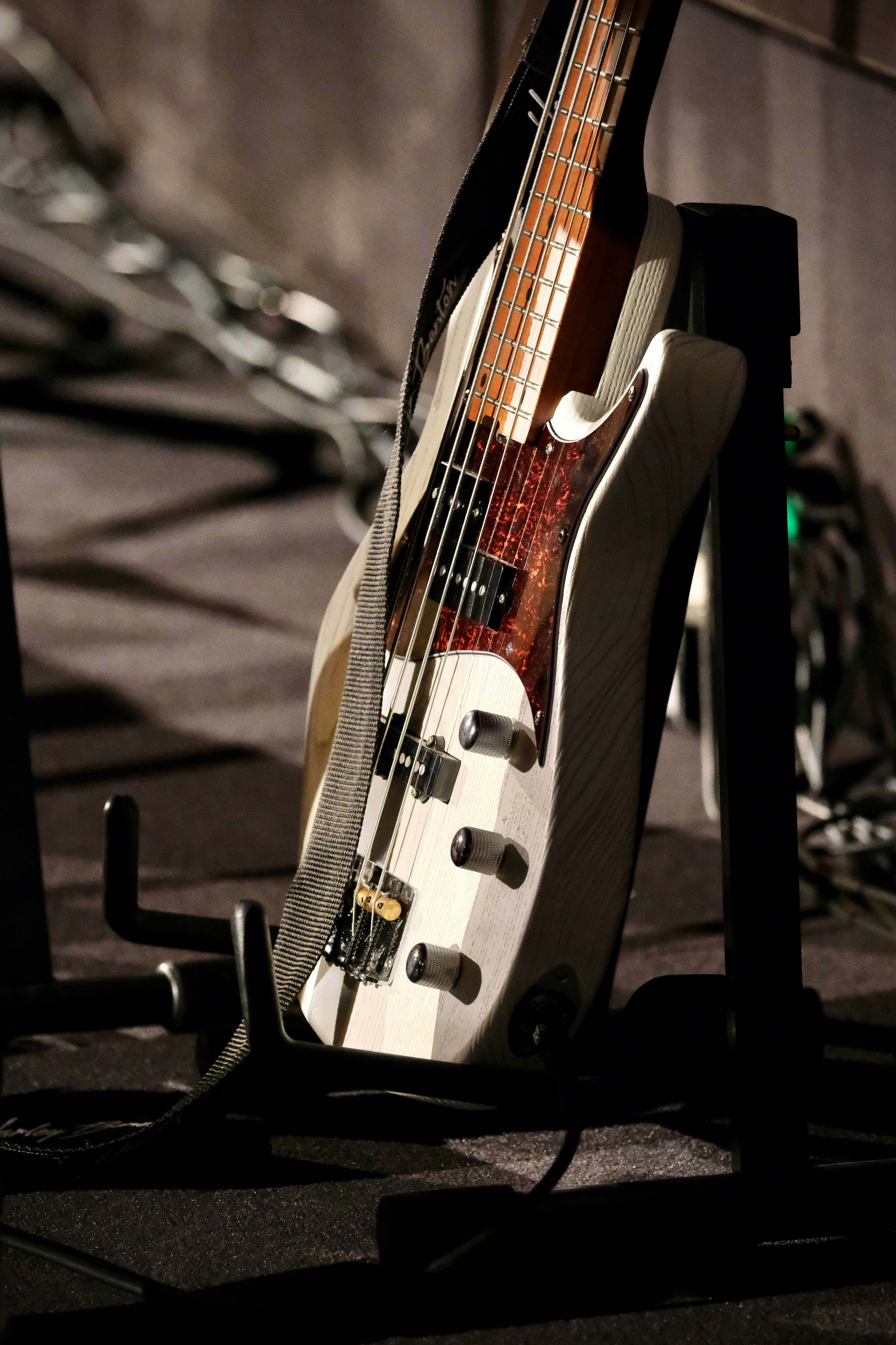 Bass in the Spotlight: A Rain-Soaked Stage Propped On a Stand
