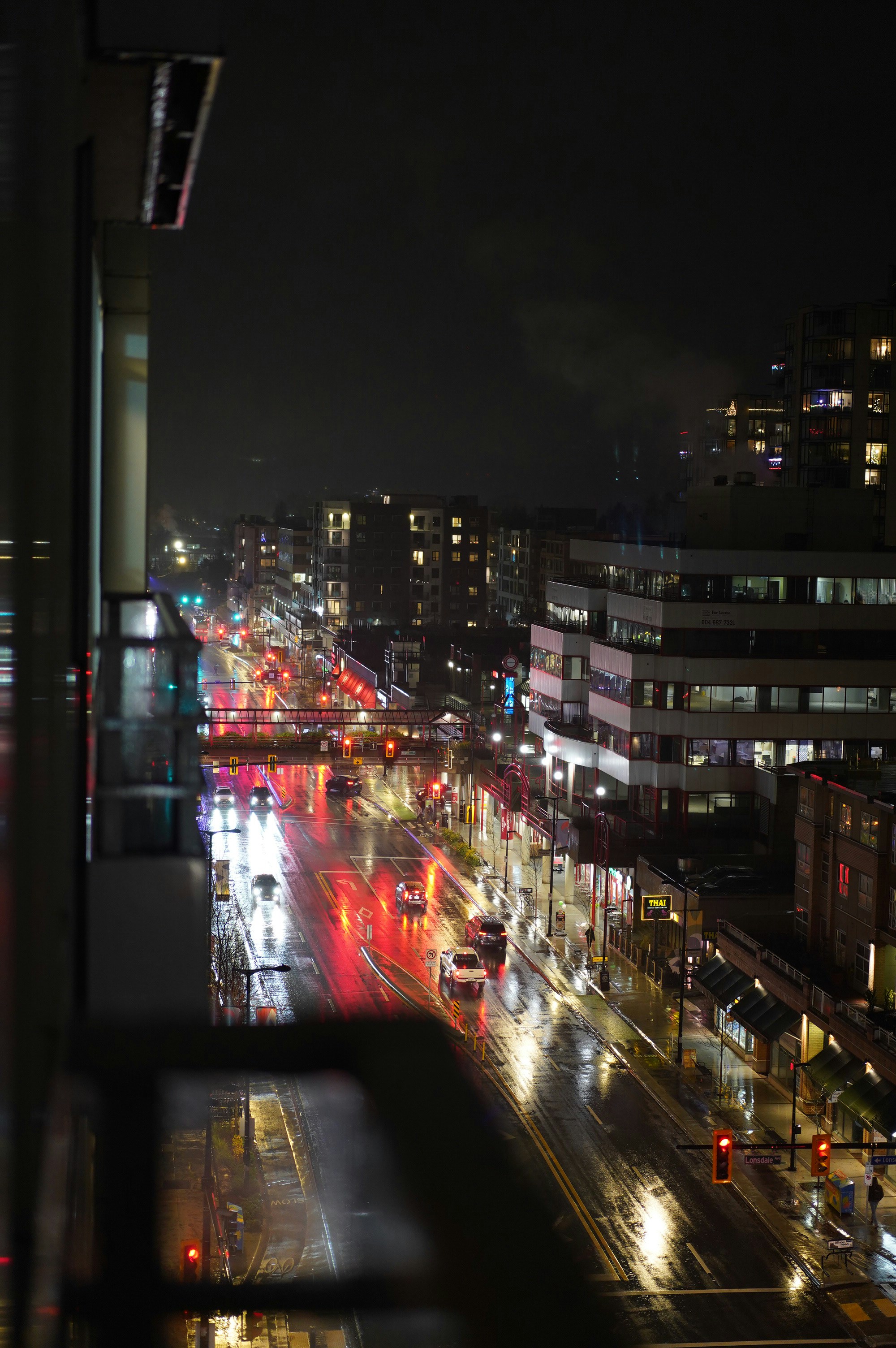 Rain-Slicked Night Corridor: Neon Arteries Through the City