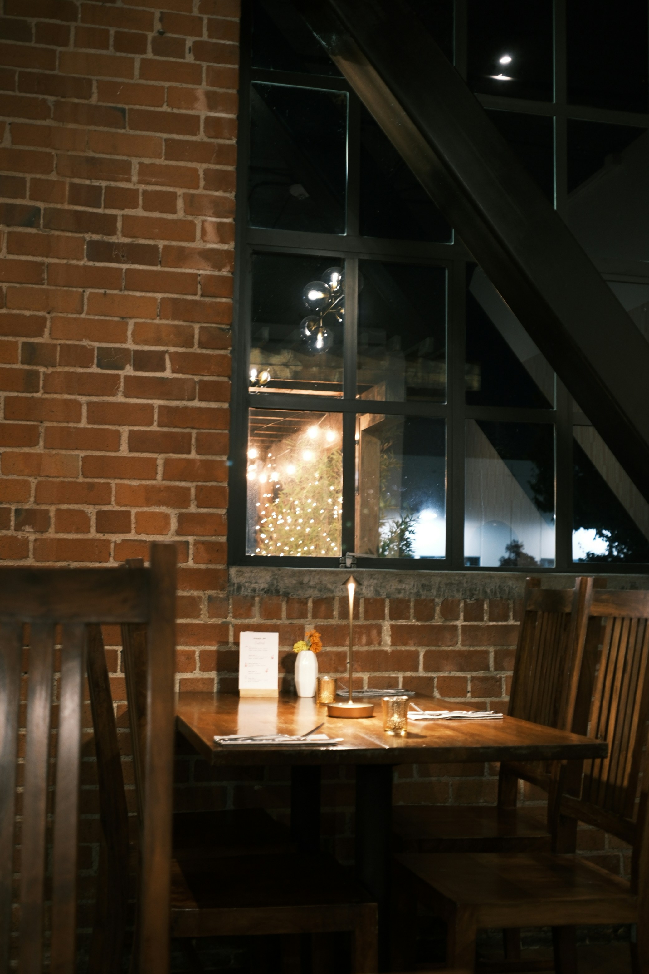Warm Hospitality at a Brick-Walled Dinner Corner