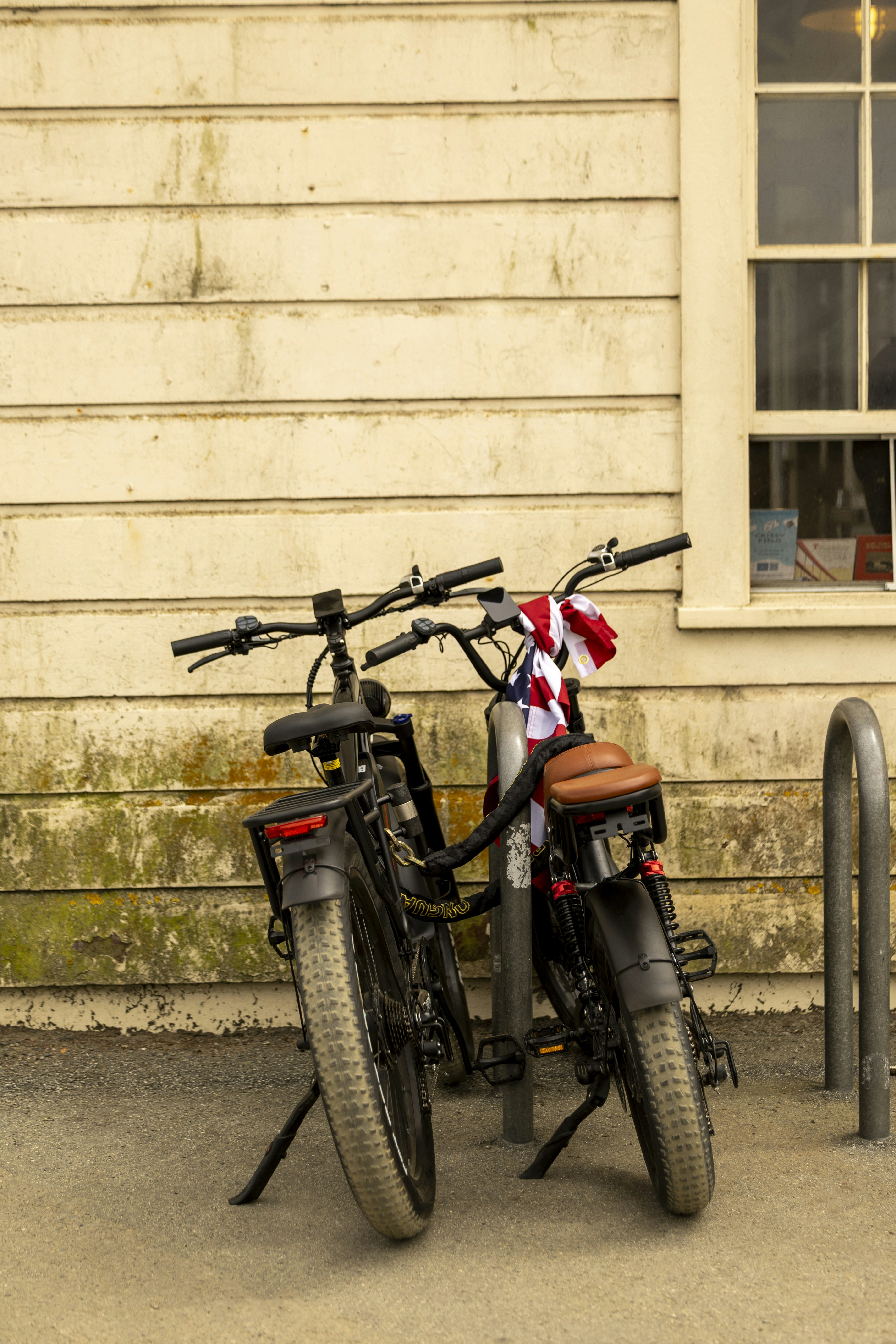 Two Bikes at a Weathered Wall